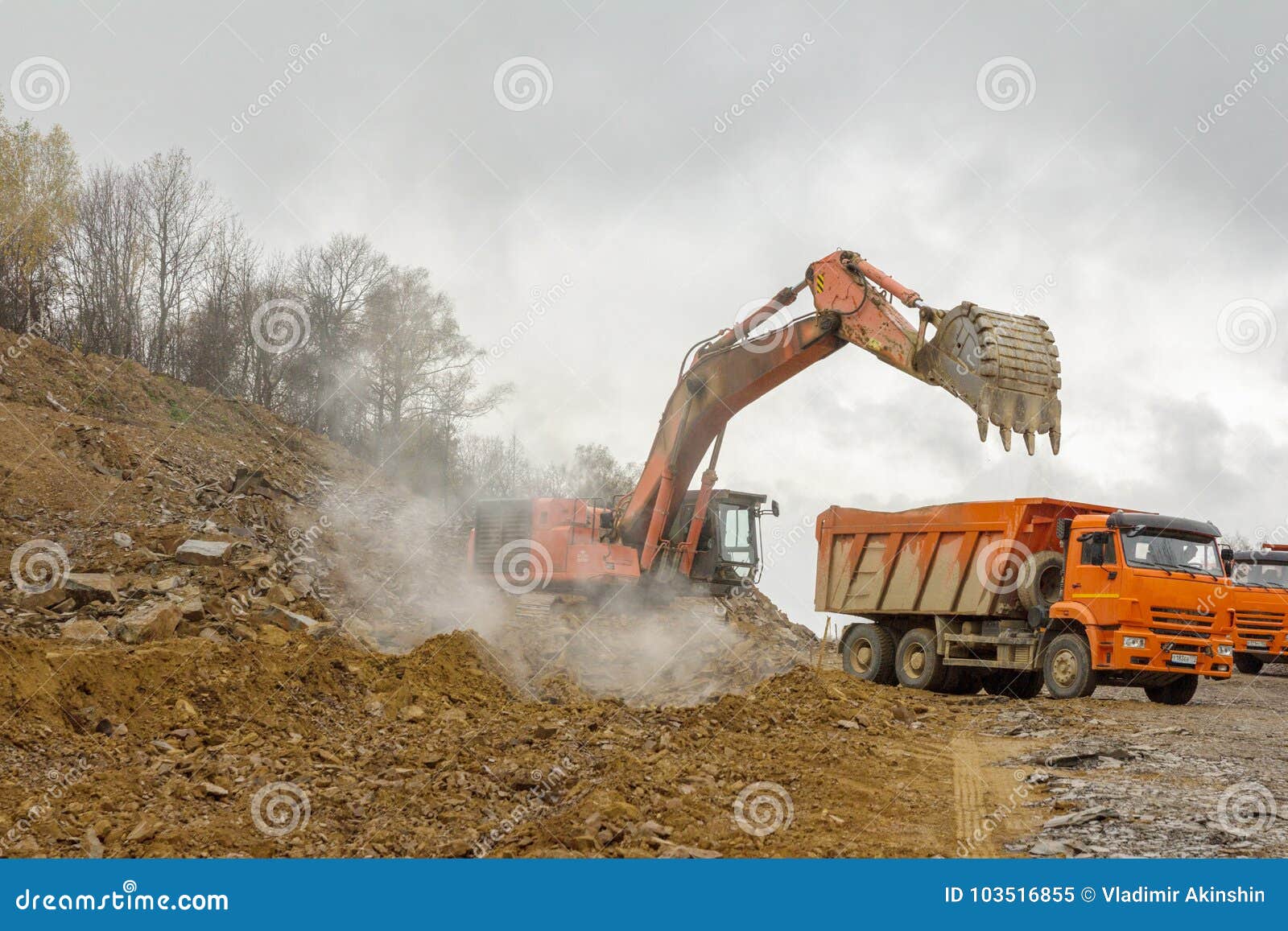 Excavator in operation editorial image. Image of road - 103516855