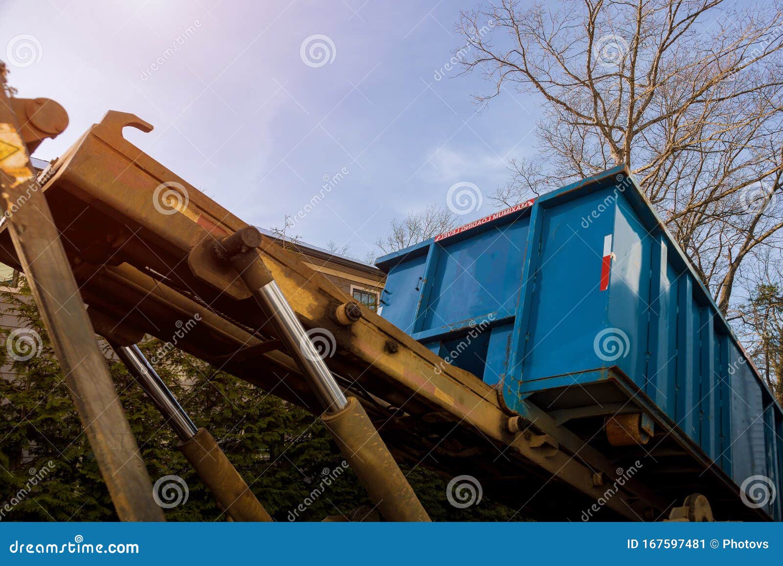 Loading the Garbage Container Old and Used Construction Material in the ...