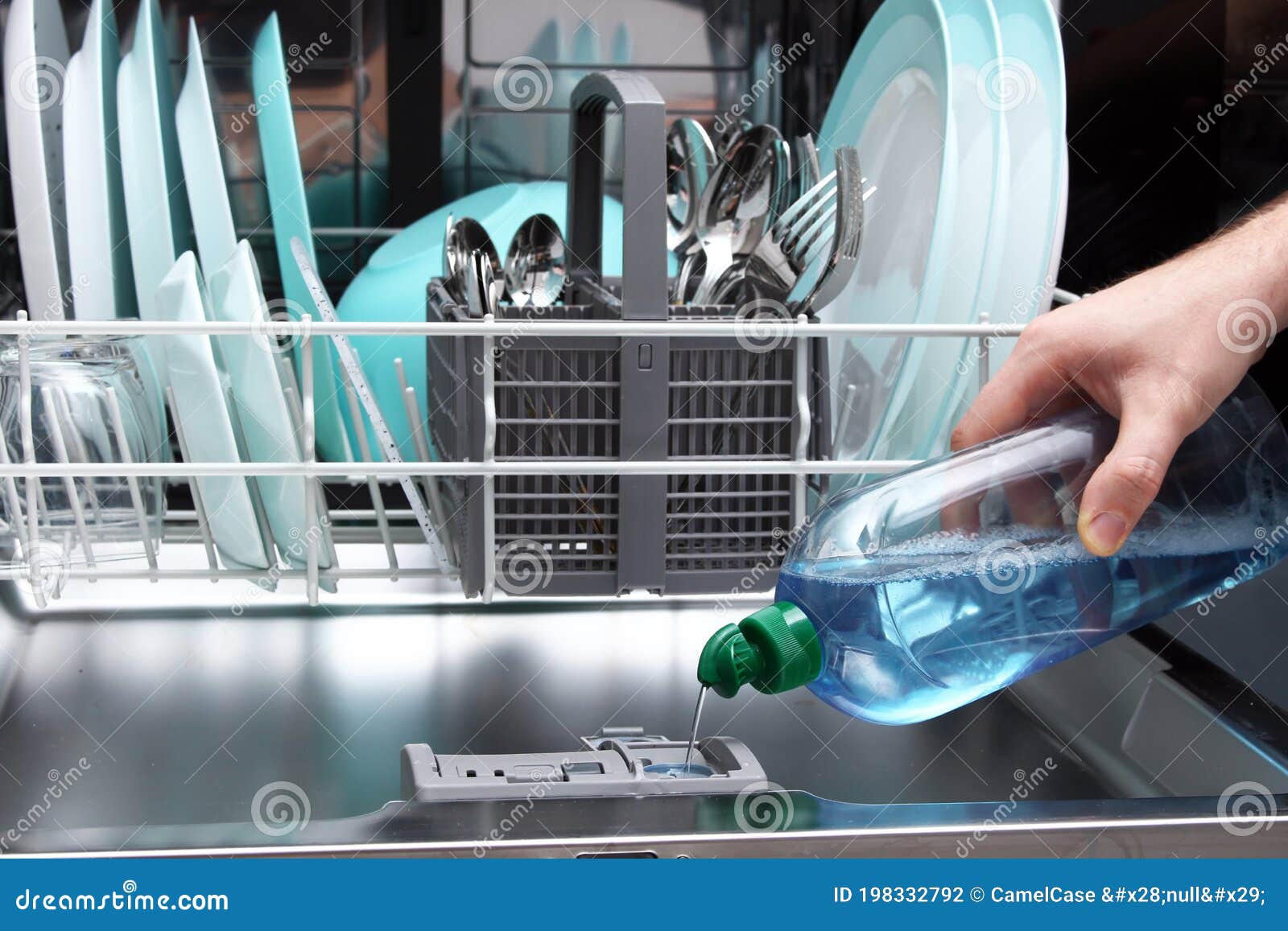 Loading the Gloss Liquid into the Dishwasher. Man Filling Dishwasher ...