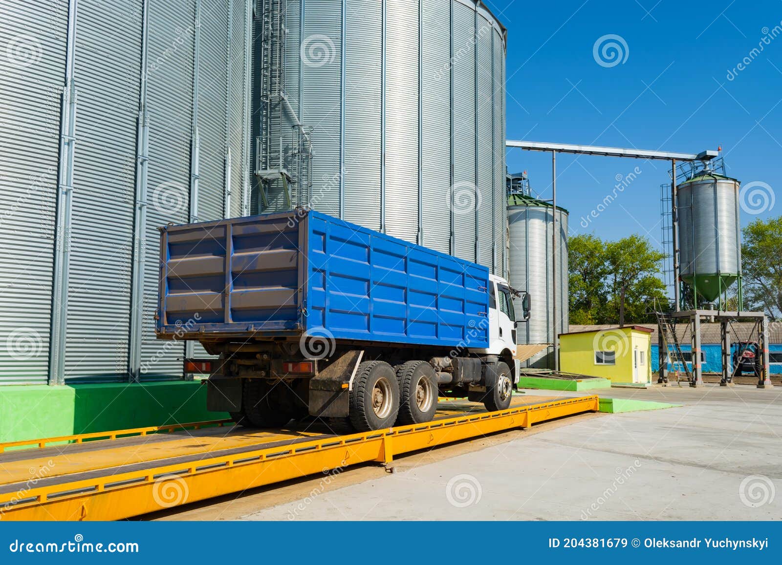 Loading Grain by Trucks Onto the Elevator into Metal Containers Stock ...