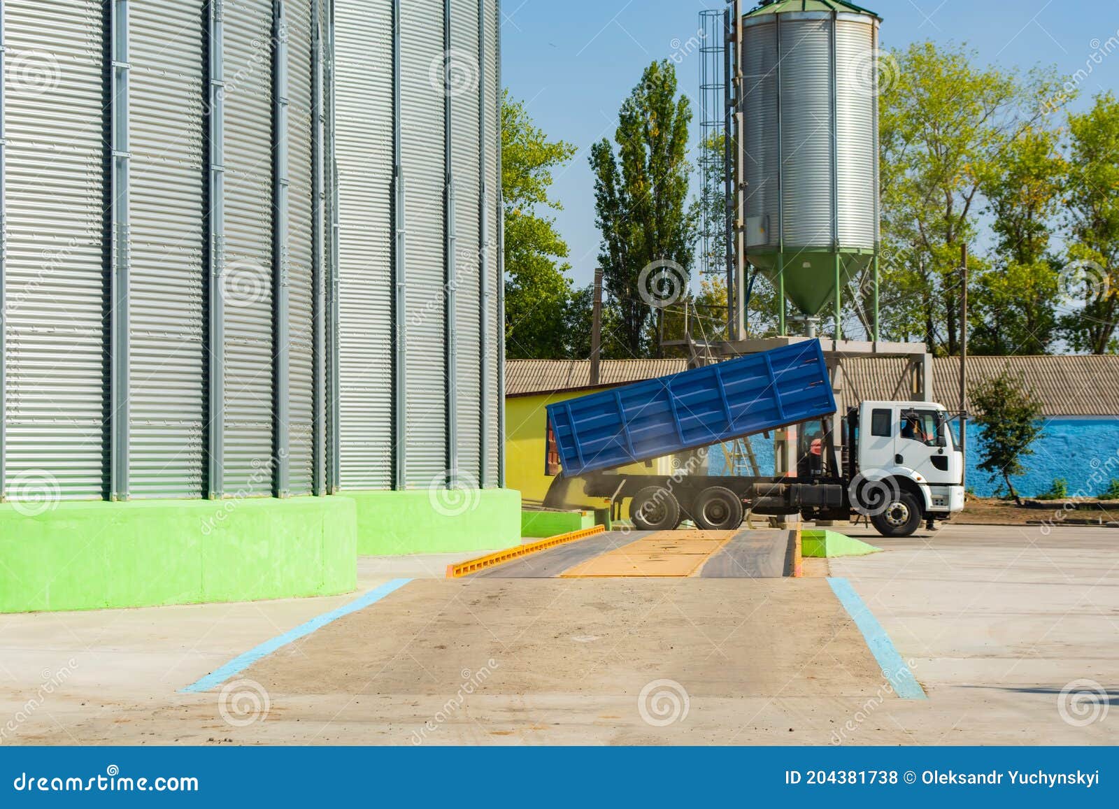 Loading Grain by Trucks Onto the Elevator into Metal Containers Stock ...