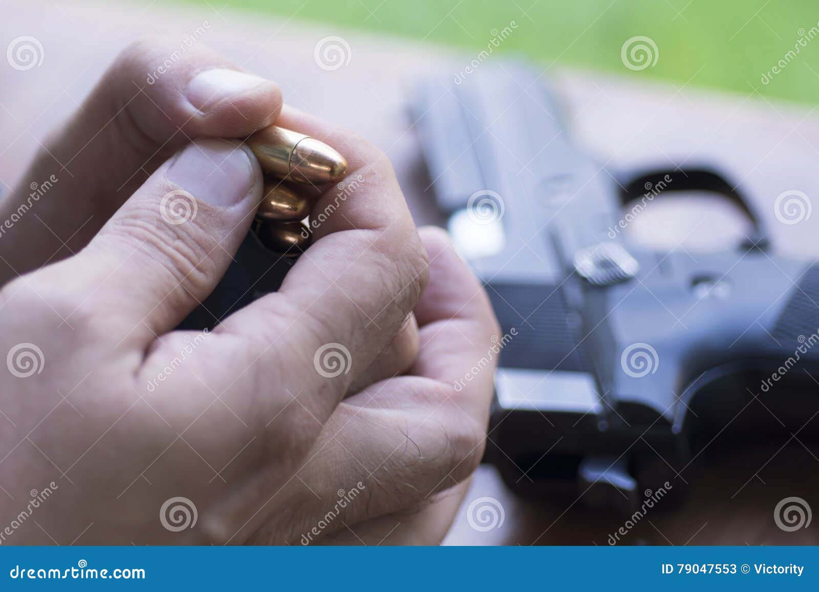 Loading Handgun Magazine. Bullets And Pistol Background. Charging Gun ...