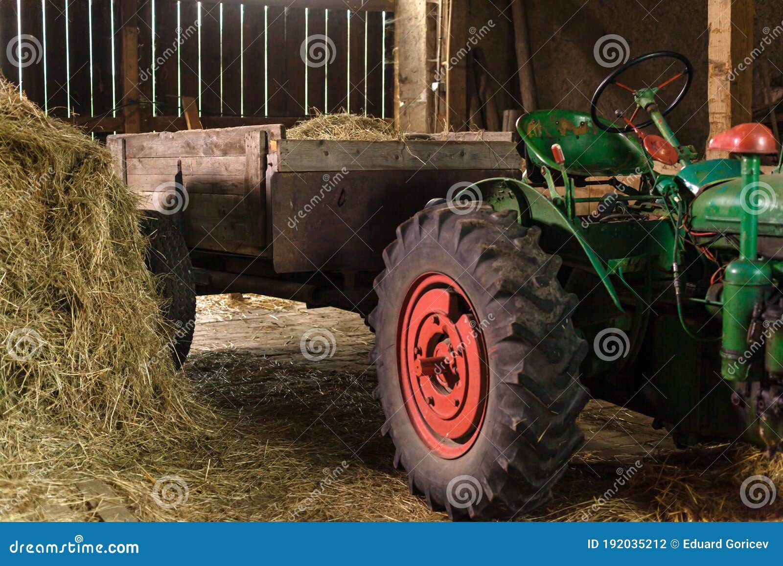 Loading Hay in a Barn on a Tractor Stock Photo - Image of bales ...