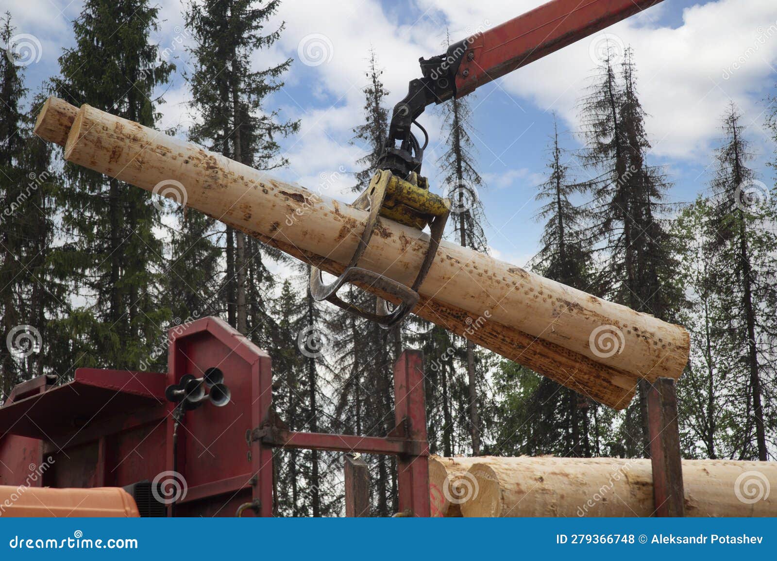 Loading Logs Onto a Logging Truck. Portable Crane on a Logging Truck ...