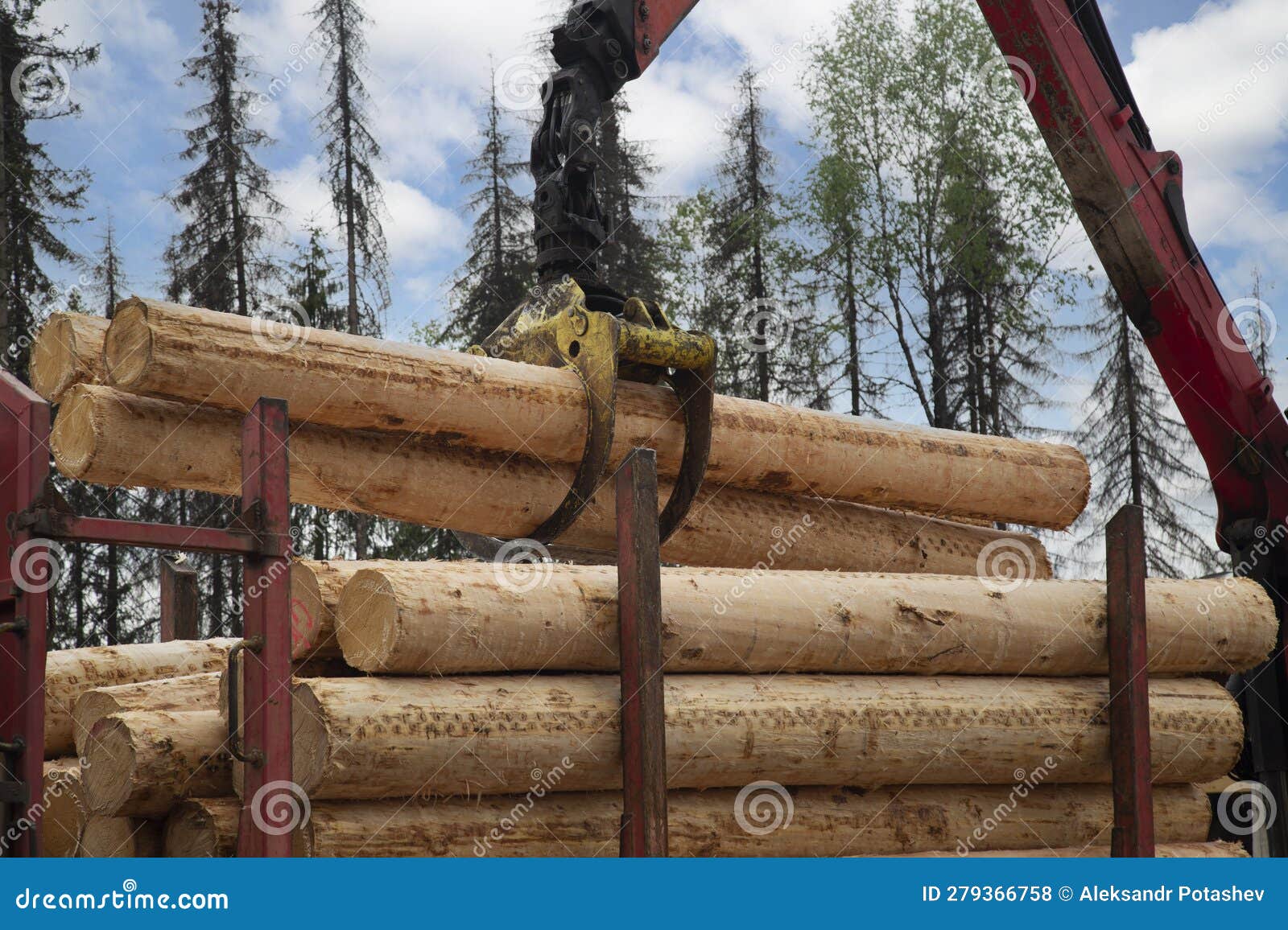 Loading Logs Onto a Logging Truck. Portable Crane on a Logging Truck ...