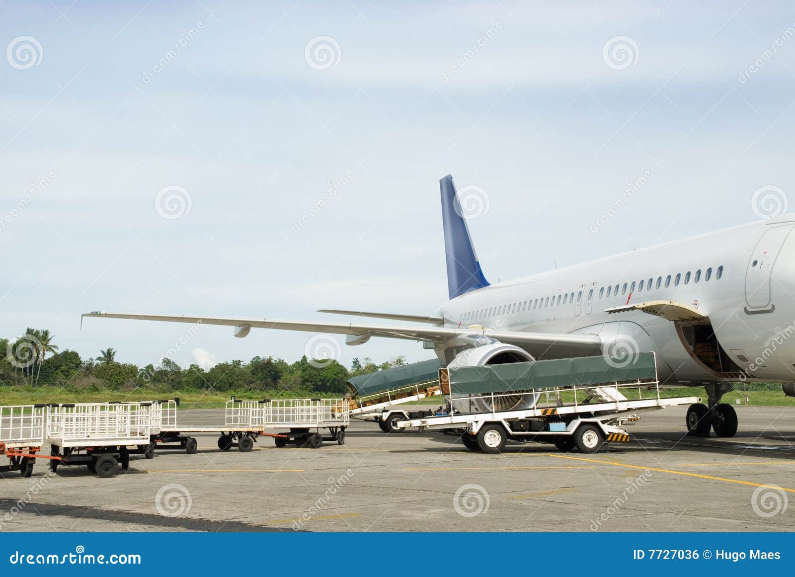 Loading Luggage in Airplane Stock Photo - Image of open, airport: 7727036