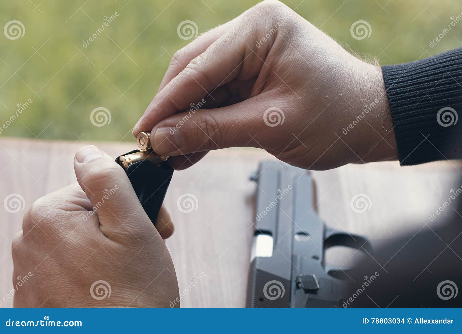 Loading Handgun Magazine. Bullets And Pistol Background. Charging Gun ...