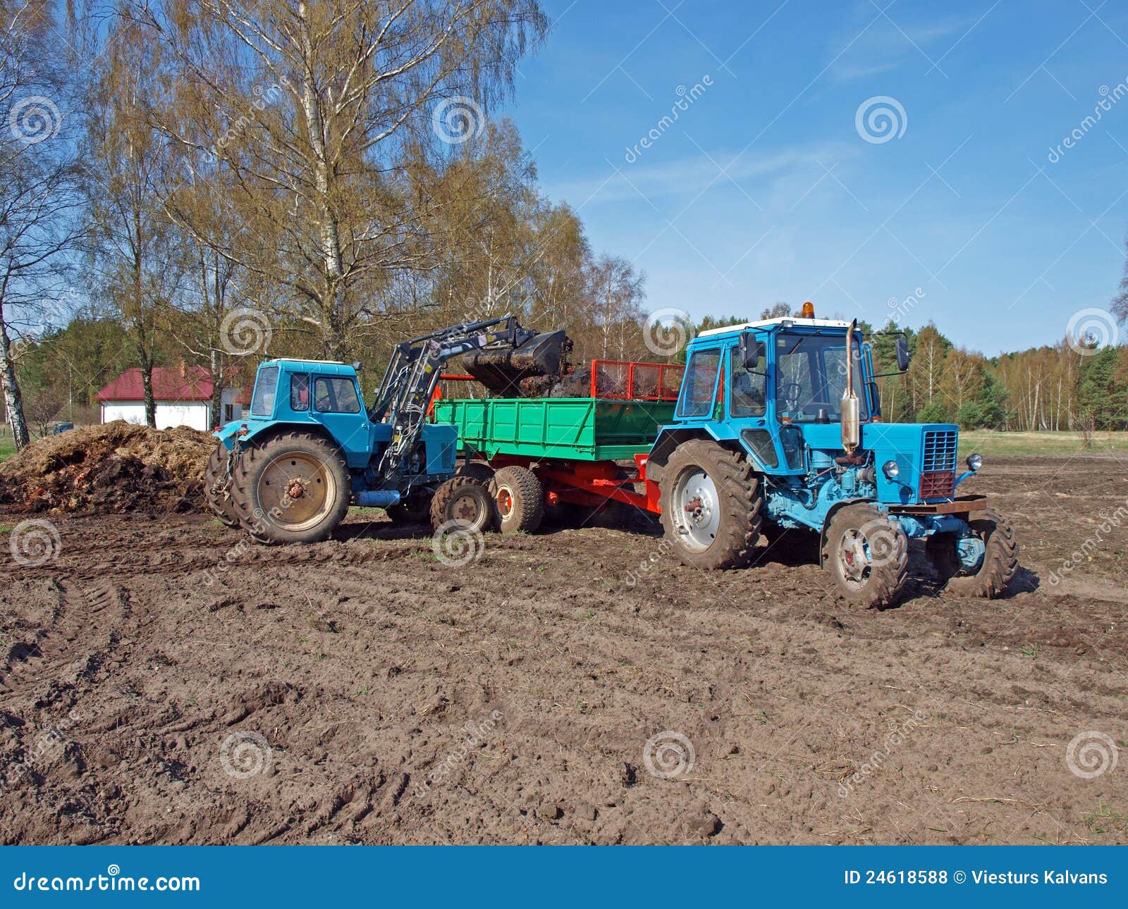 Loading manure spreader 3 stock photo. Image of field - 24618588