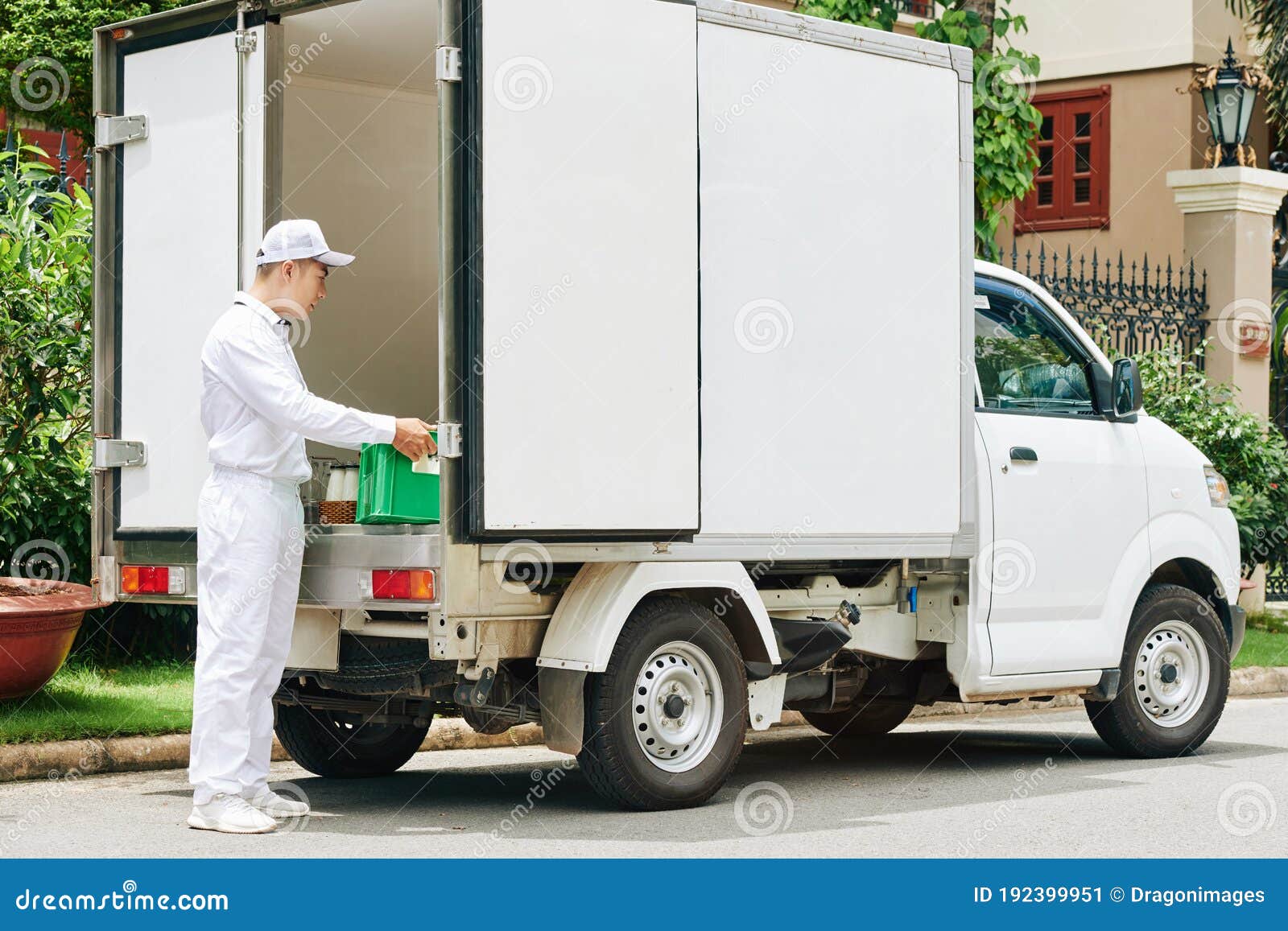 Loading milk float stock image. Image of occupation - 192399951