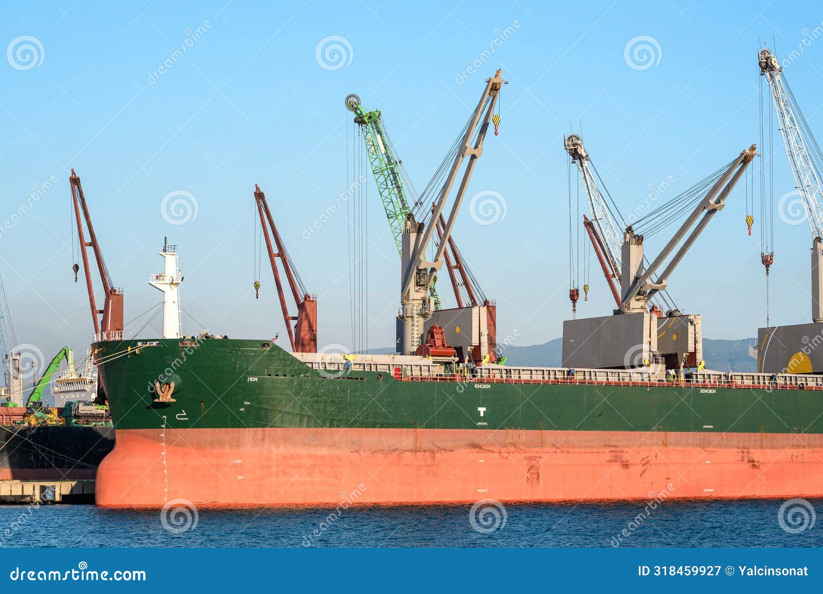 Loading Onto Bulk Carrier Ship at Commercial Port on a Sunny Day Stock ...
