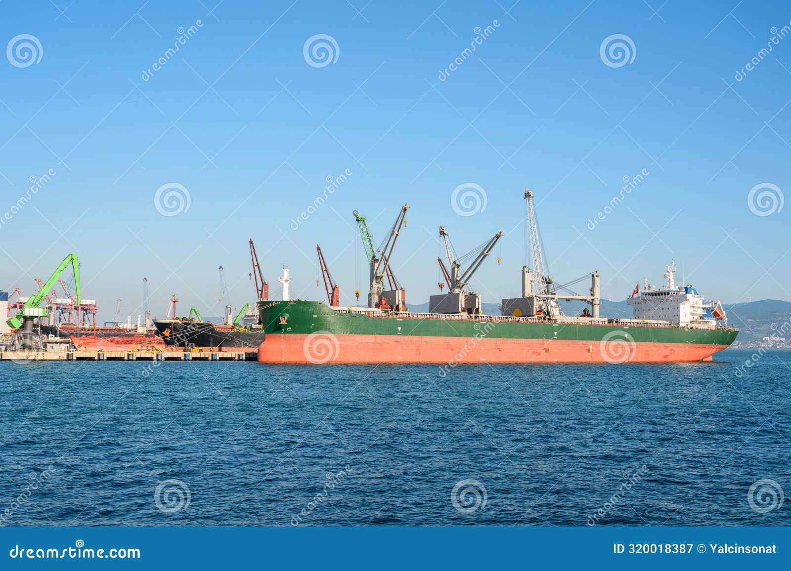 Loading Onto Bulk Carrier Ship at Commercial Port on a Sunny Day Stock ...