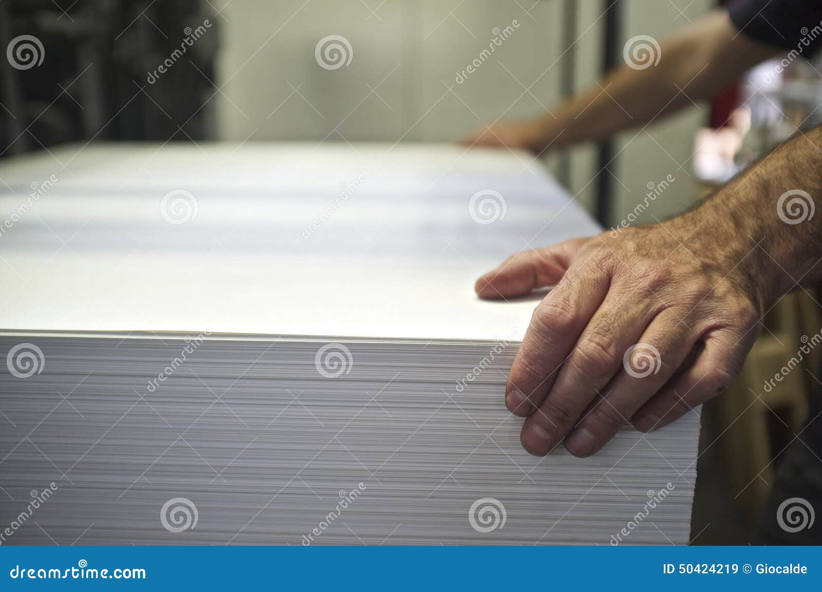 Loading of paper operation stock image. Image of book - 50424219