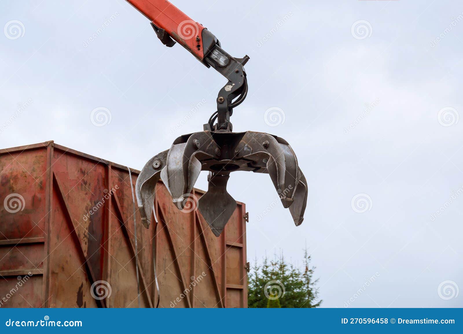 Loading Scrap Metal into a Truck. Crane Grabber Loading Metal Rusty ...