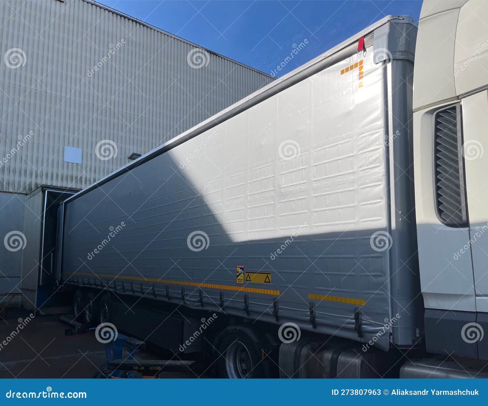 Loading or Unloading Cargo in a Tractor Trailer on a Ramp Stock Image ...