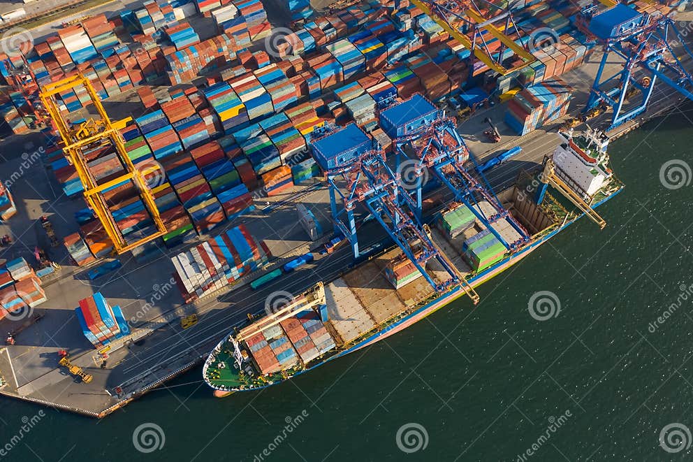 Loading and Unloading a Container Ship in the Port at the Pier Stock ...