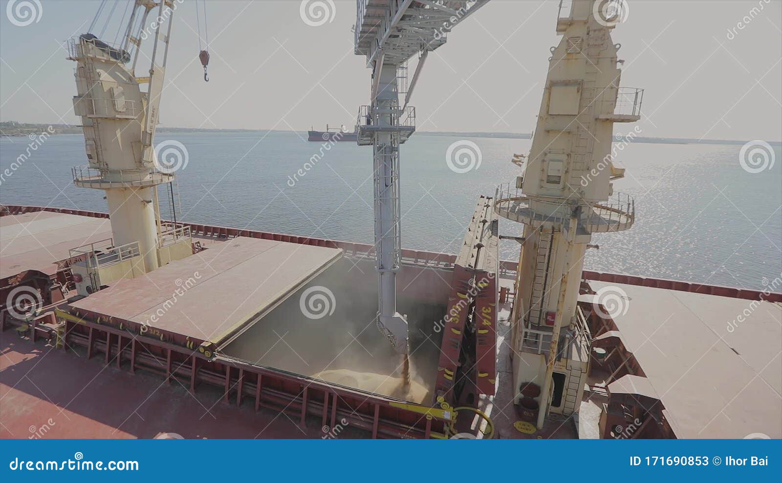 Loading Wheat into a Cargo Ship for Transportation by Sea. the Ship is ...