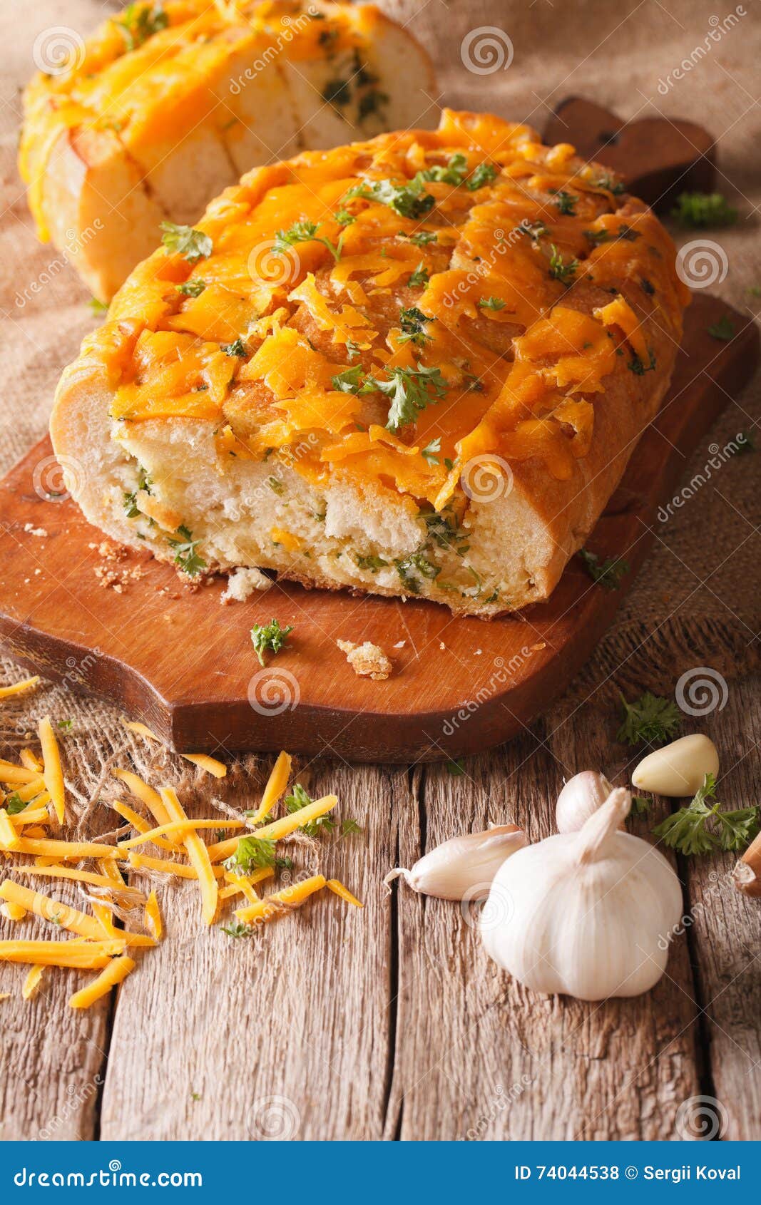 Loaf of Bread Baked with Cheddar Cheese, Garlic and Herbs Closeup ...