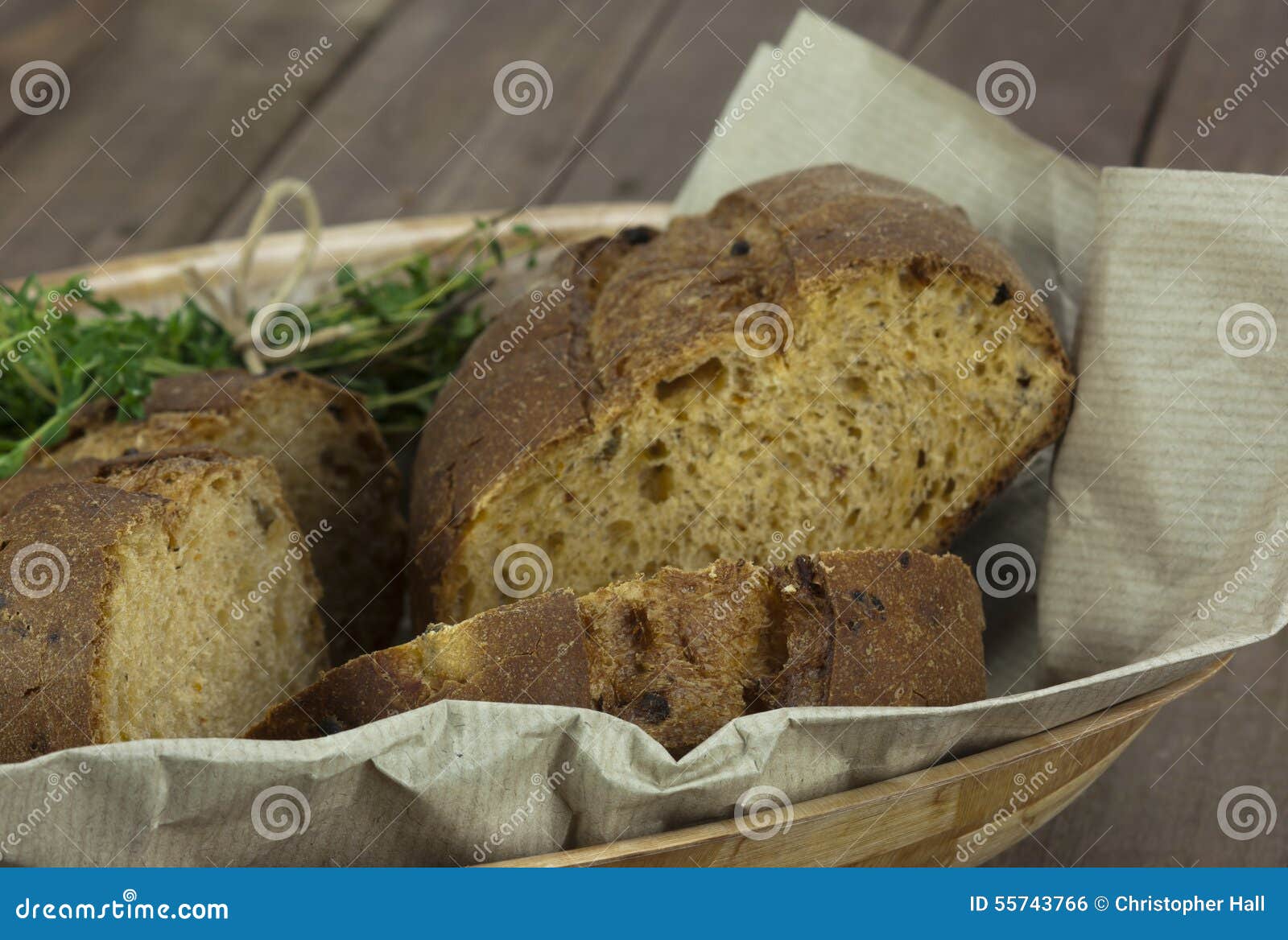 Loaf of bread in a basket stock photo. Image of sliced - 55743766