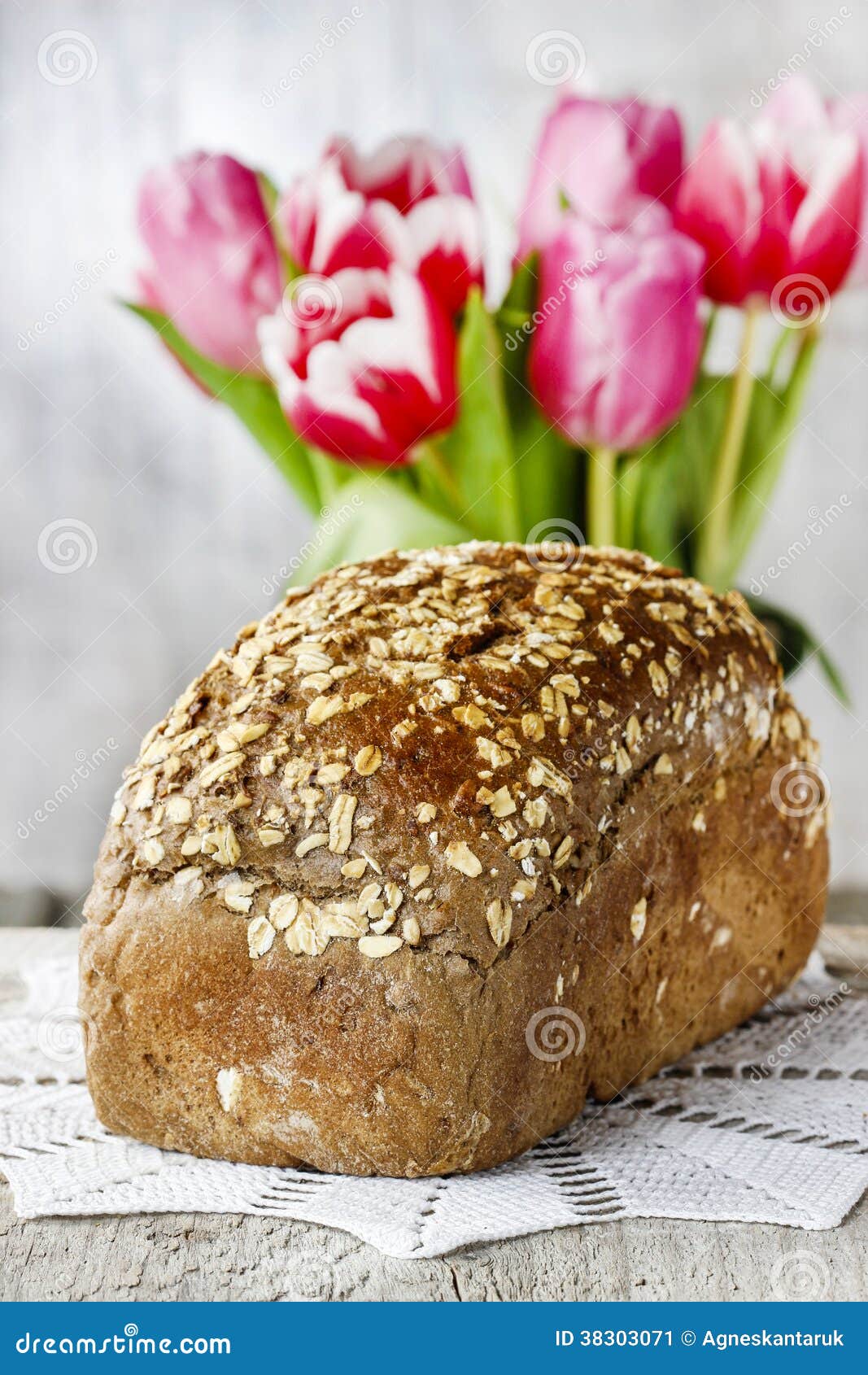 Loaf of Bread. Bouquet of Red and Pink Tulips Stock Image - Image of ...
