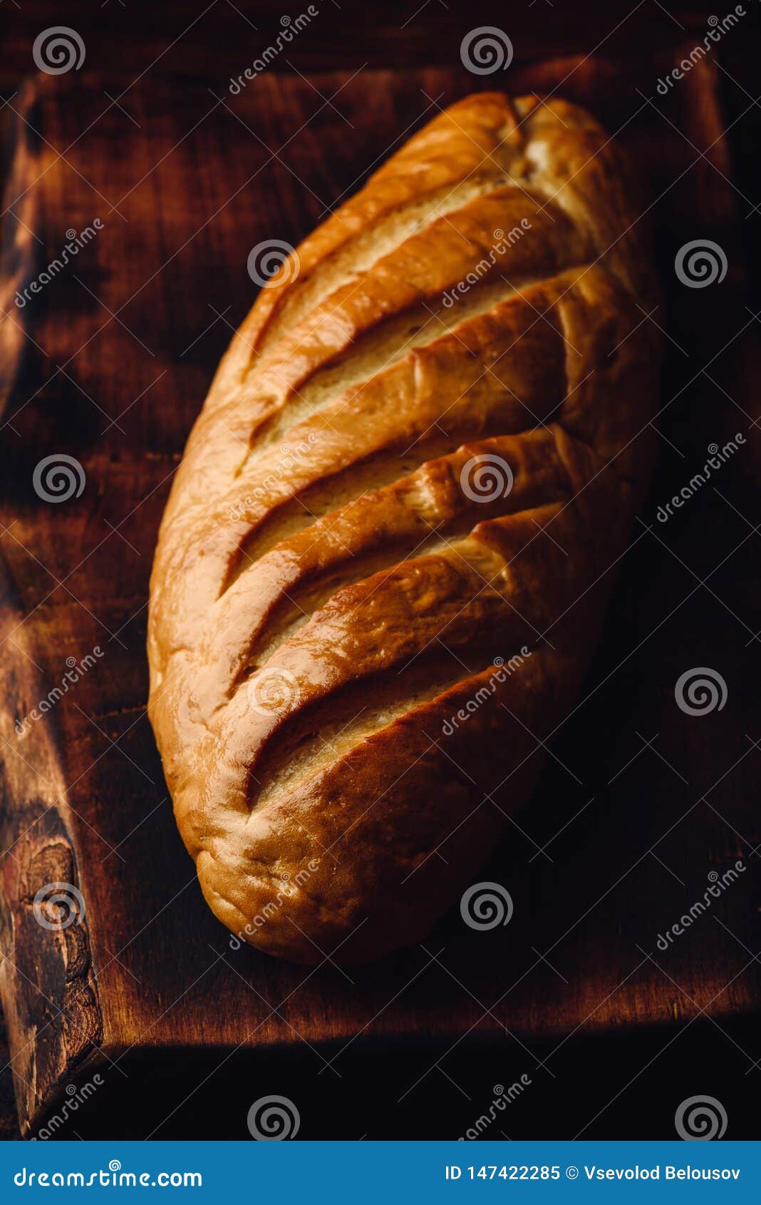 A loaf of bread on a table stock image. Image of lunch - 147422285