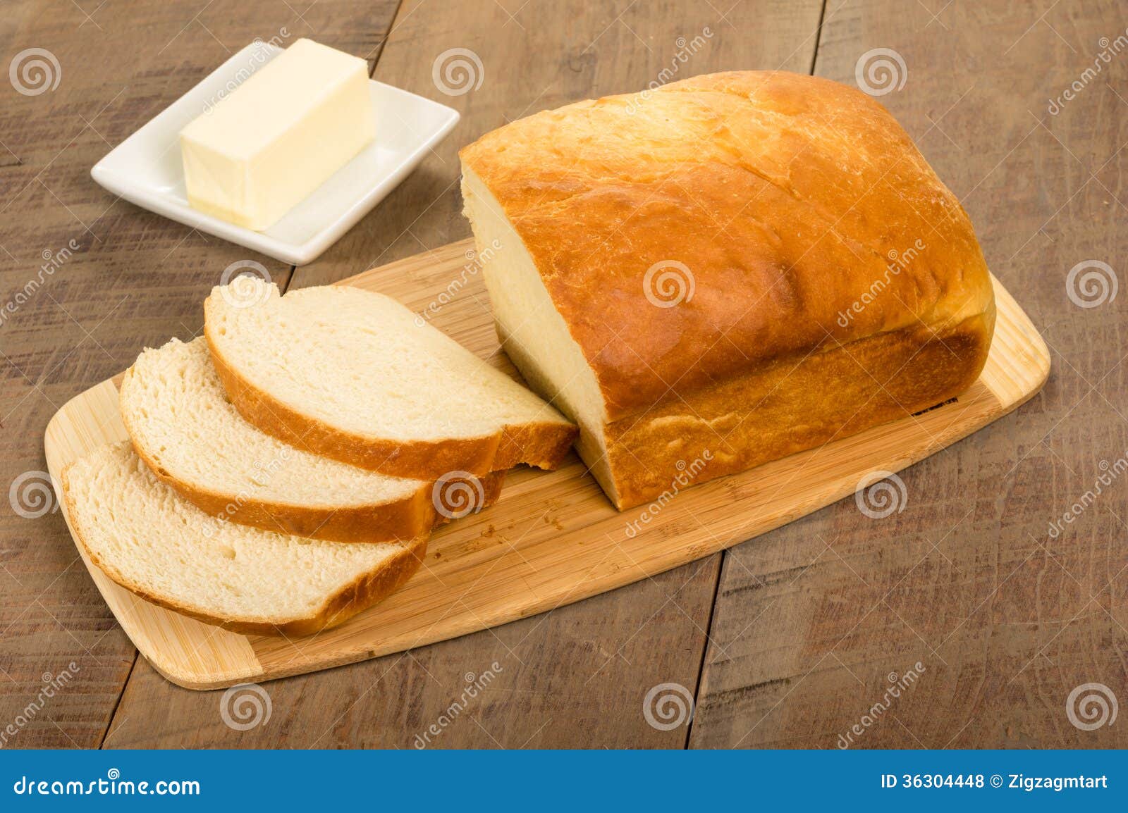 Loaf of Sliced Bread with Butter Plate Stock Photo - Image of brown ...