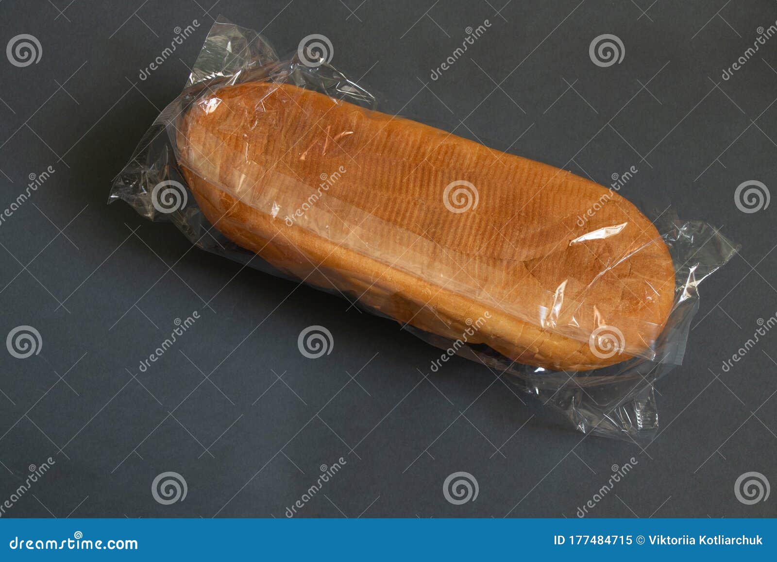 Loaf of White Bread in a Package on a Dark Isolated Background Stock ...