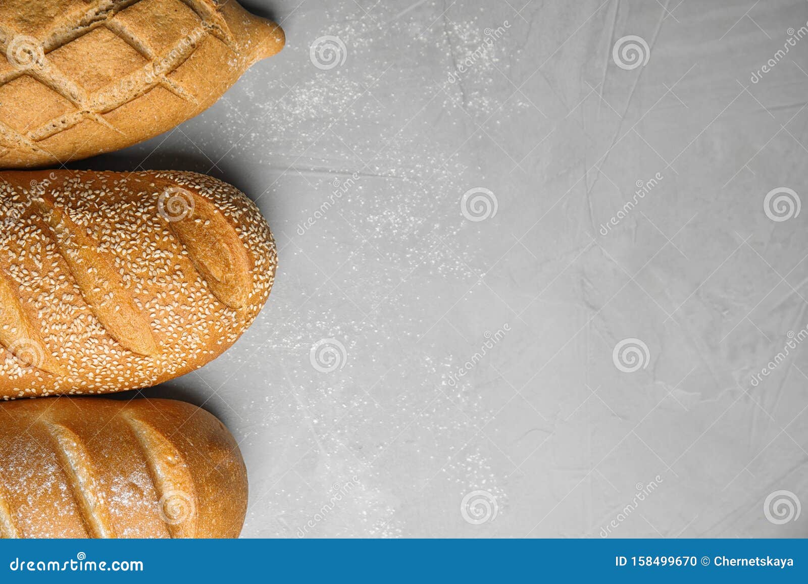 Loaves Of Different Types Of Bread In Wheat Field Homemade Baking