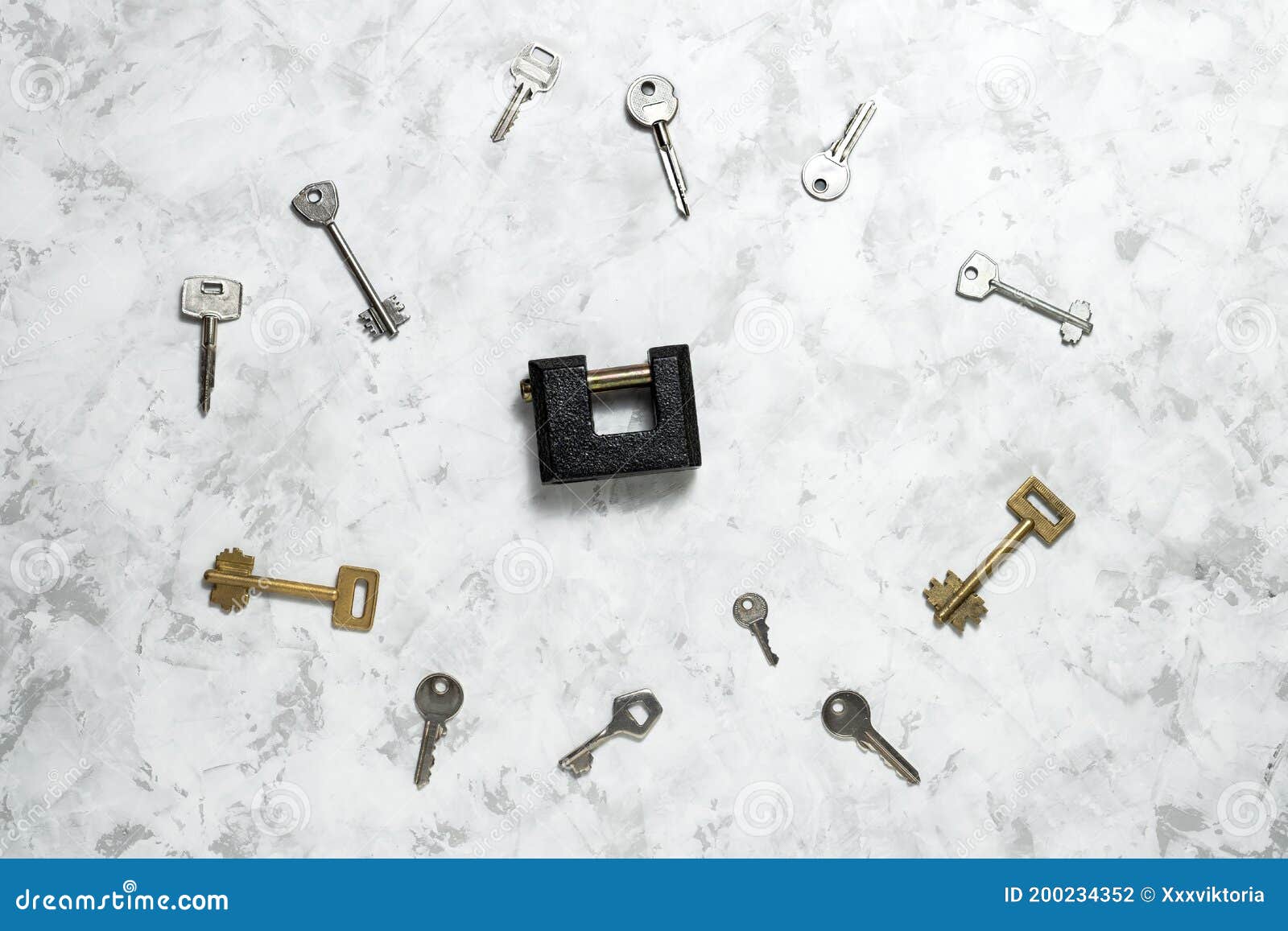 Lock and Variety of Keys on Grey Concrete Background Stock Photo ...