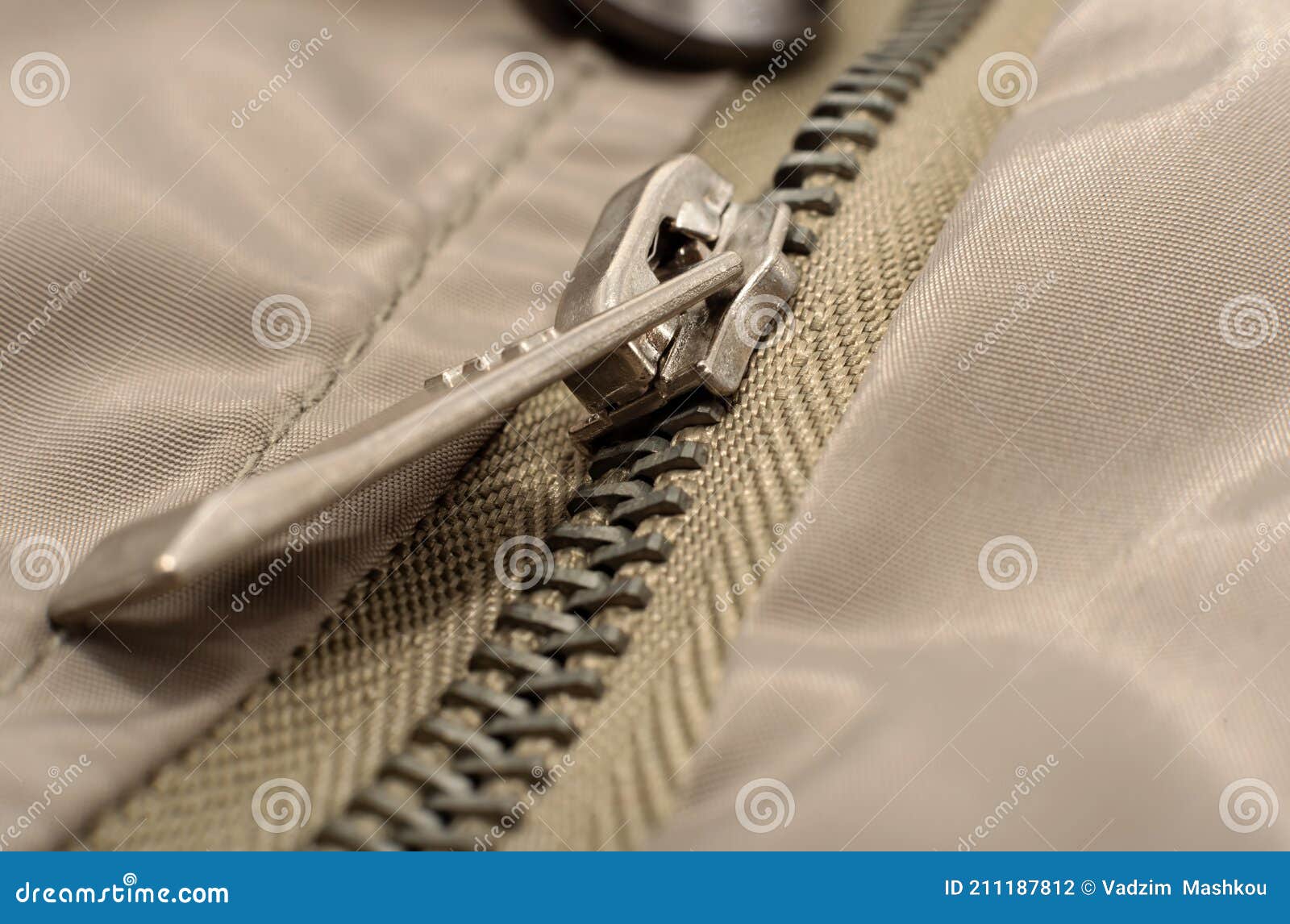 The Lock with a Zipper is Close-up on the Clothes of Gray Color. Zipper ...