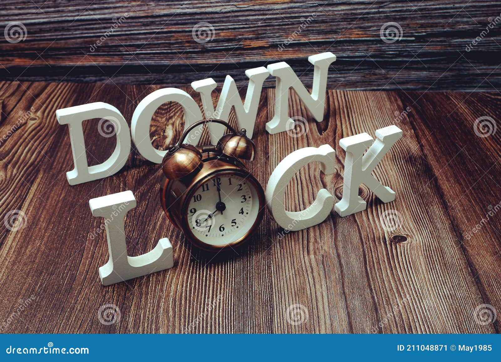 Lock Down Alphabet Letters with Alarm Clock on Wooden Background Stock ...