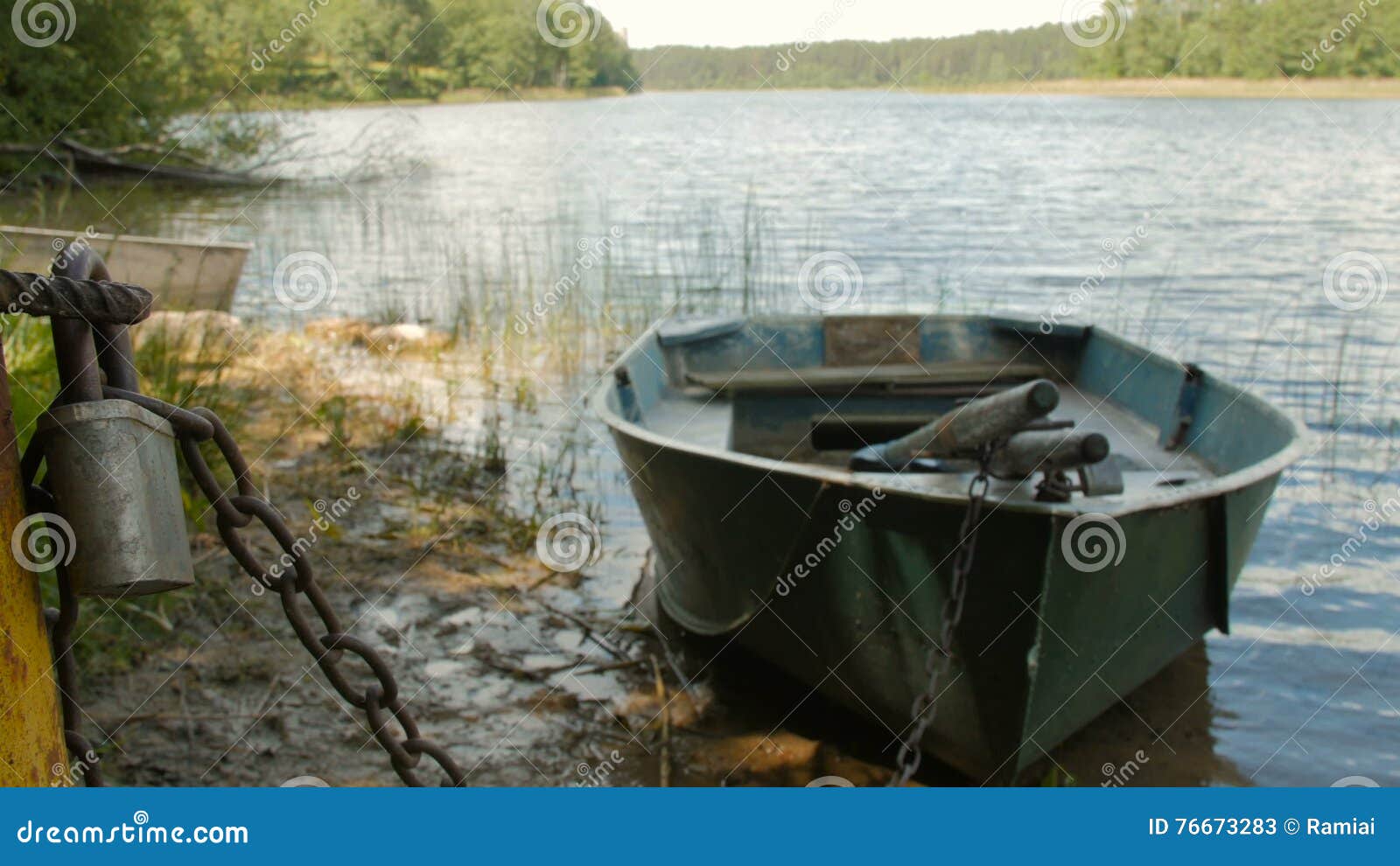 Locked boat by the lake stock video. Video of creation - 76673283
