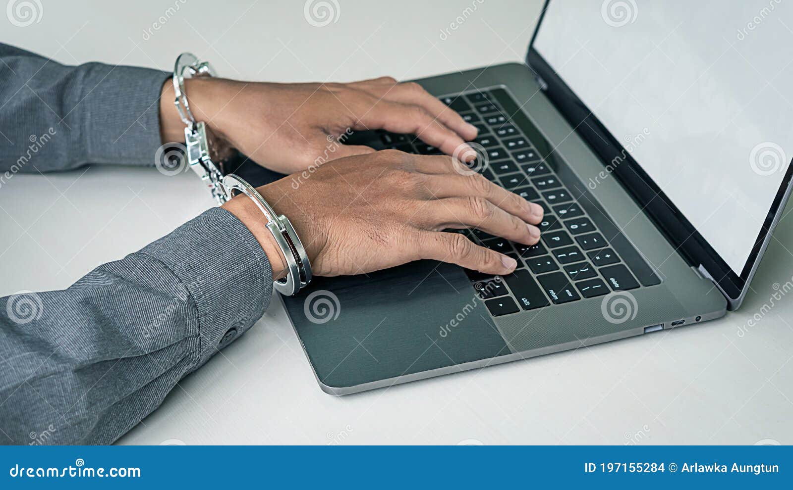 Locked Hands, Handcuffs, and Playing Laptop Computers Stock Photo ...