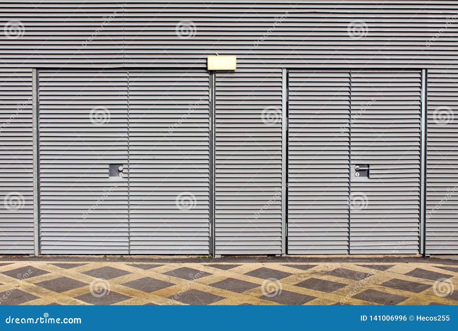 Locked Metal Doors on Industrial Complex Building Covered with Metal ...