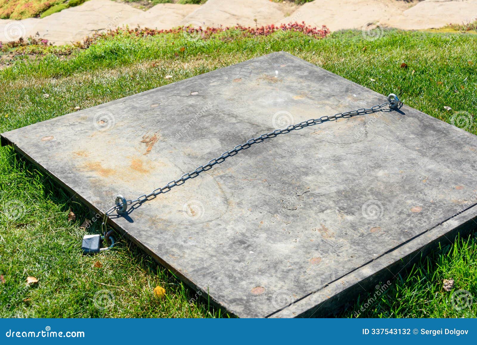 Locked Metal Hatch with Chain on Grassy Ground. Stock Photo - Image of ...