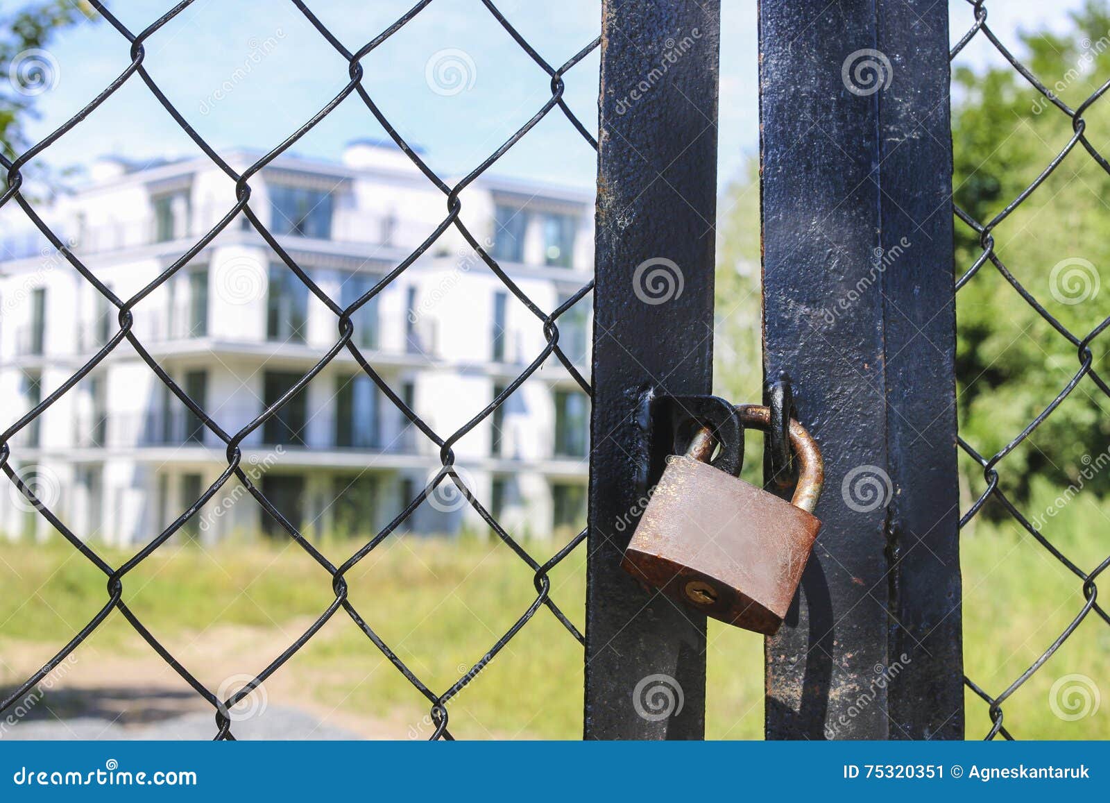 Locked Padlock on the Gate To the Abandoned Building Stock Image ...