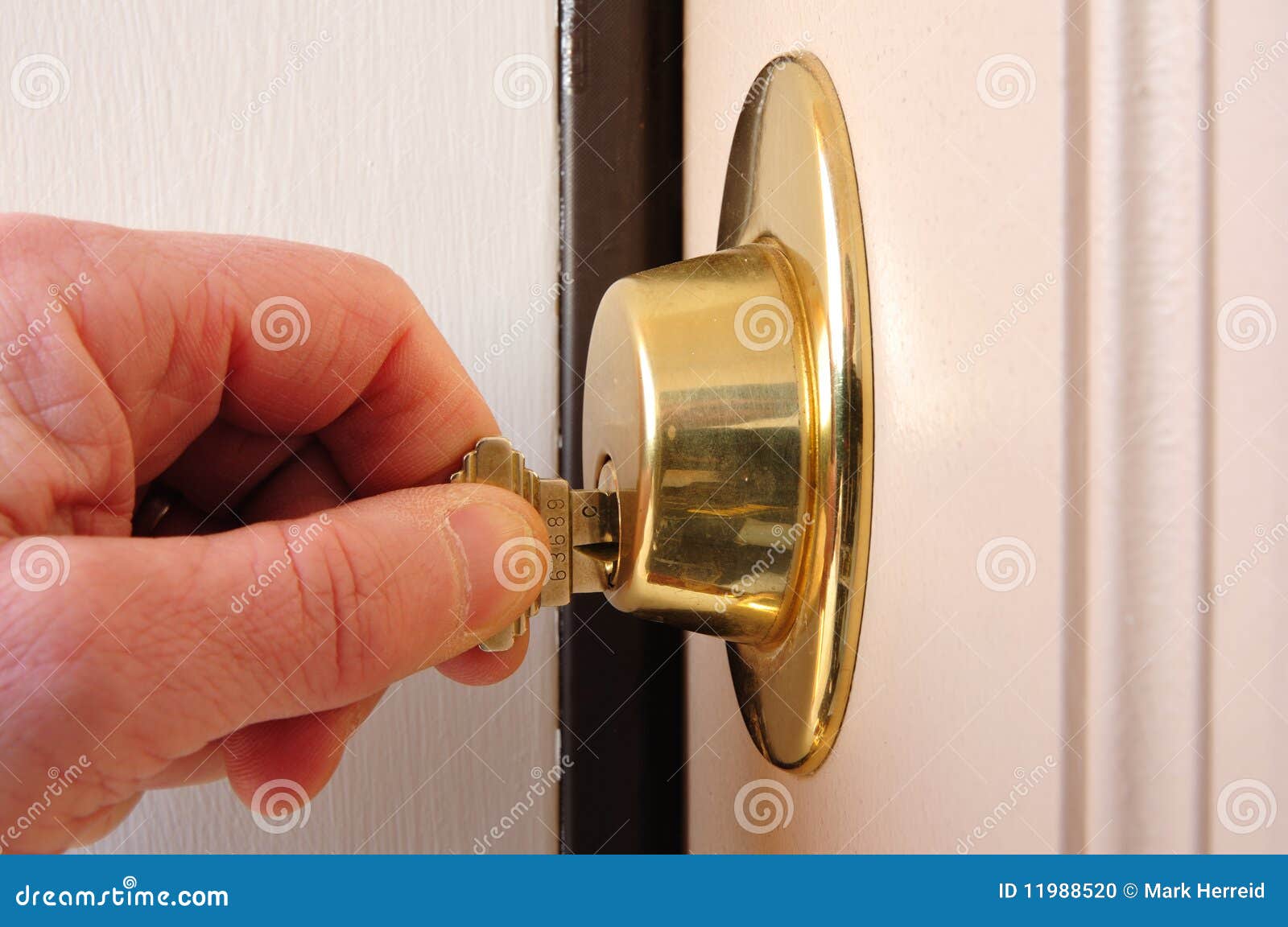 Locking a Dead Bolt stock photo. Image of protection - 11988520