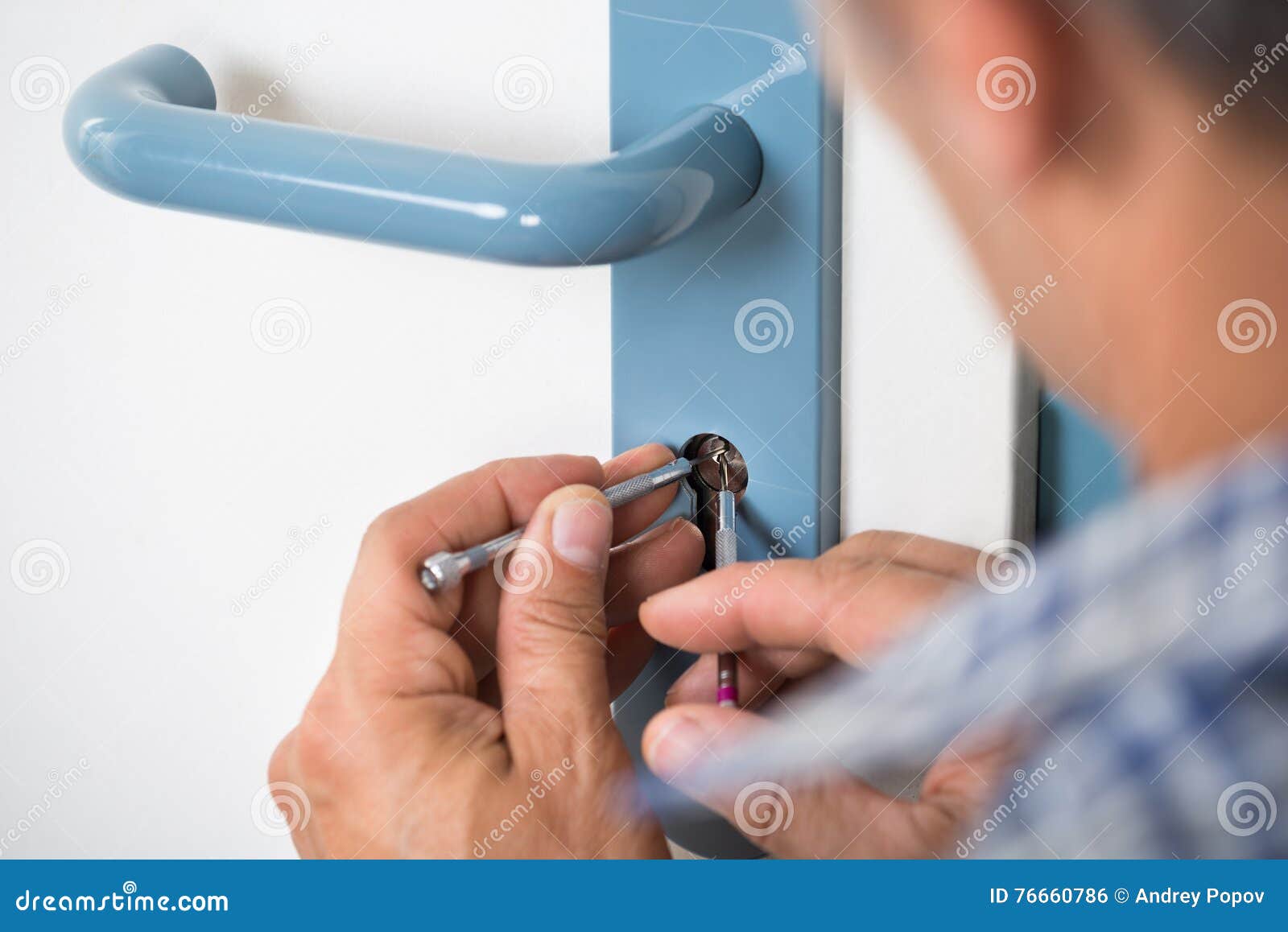 Lockpicker Fixing Door Handle at Home Stock Photo - Image of blue ...