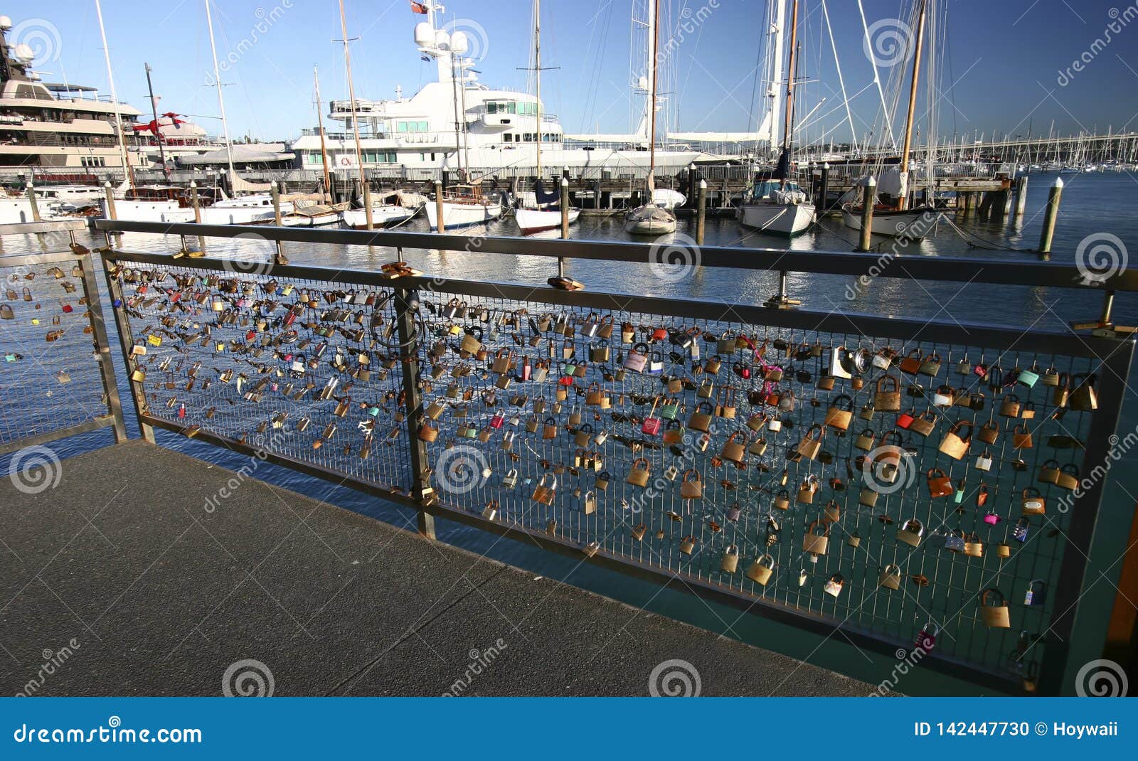 Padlocks of Love on Metal Guardrail at Marina with Sailboats in Silo ...