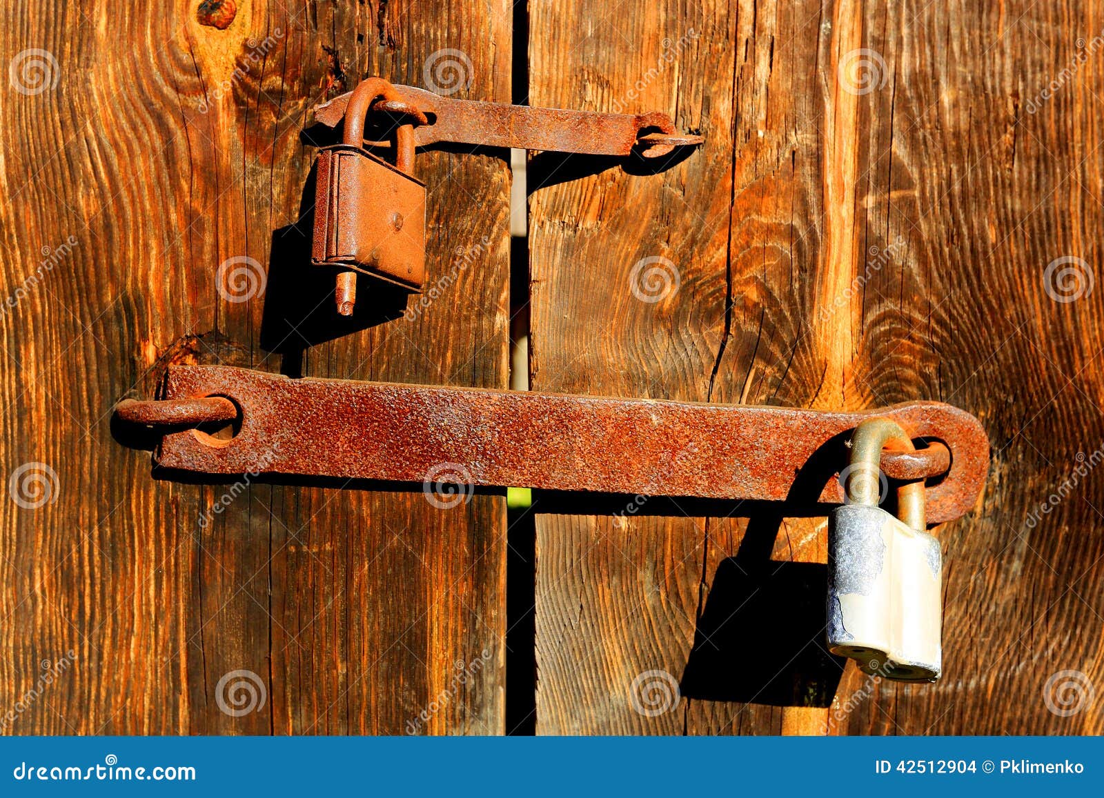 Locks on wooden door stock photo. Image of background - 42512904