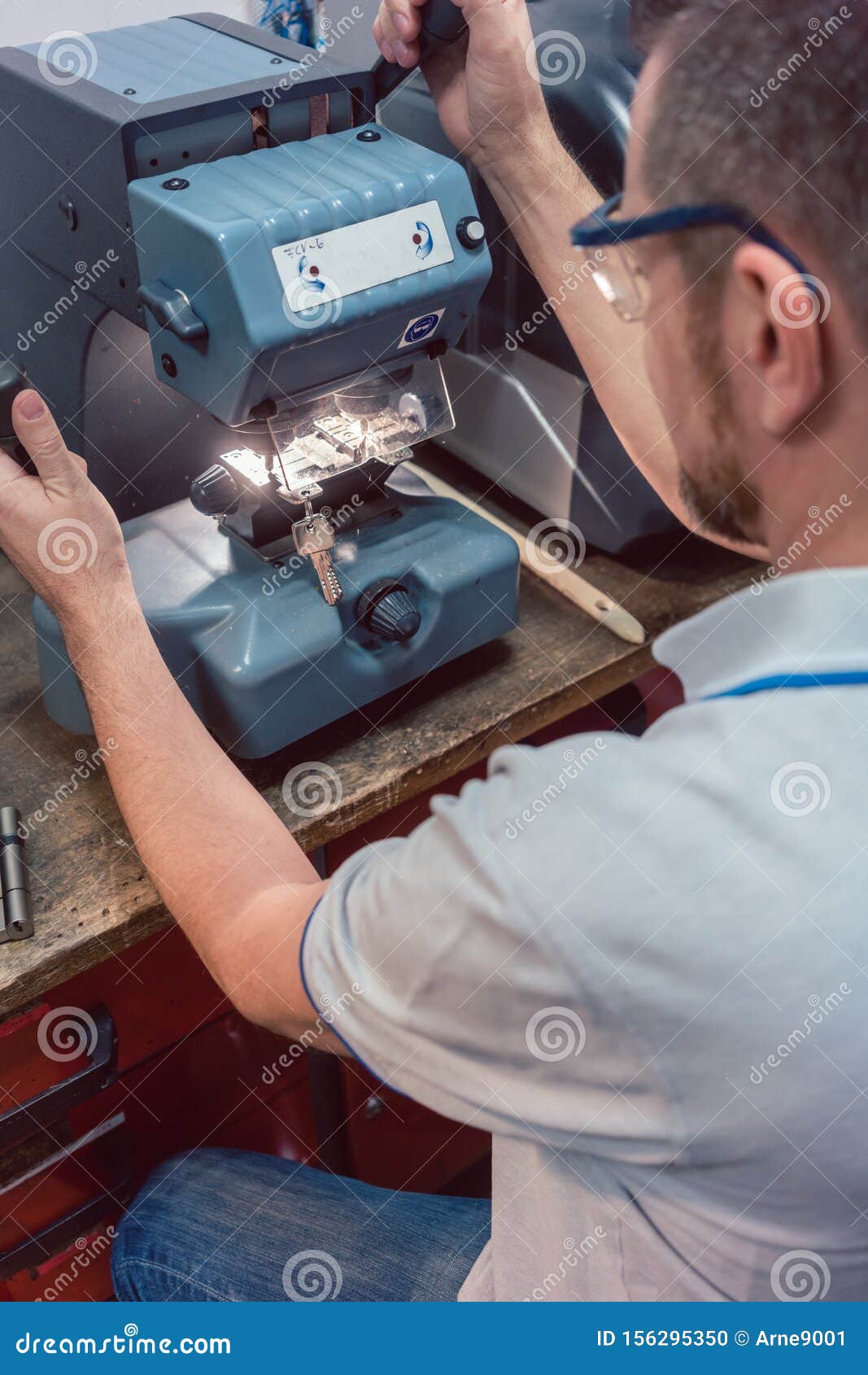 Locksmith Cutting Key with His Machine Stock Photo - Image of male ...