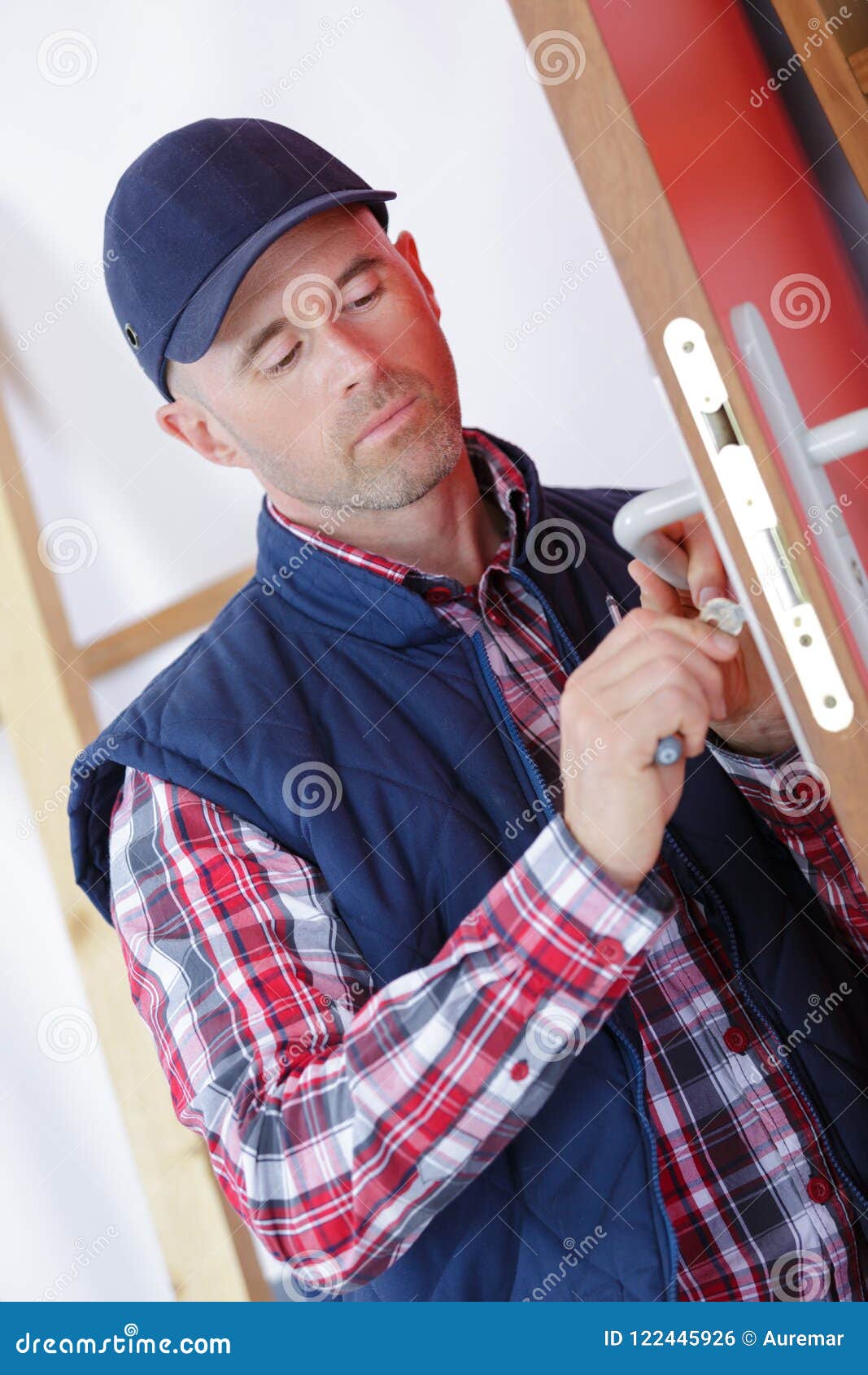 Locksmith doing his job stock photo. Image of working - 122445926