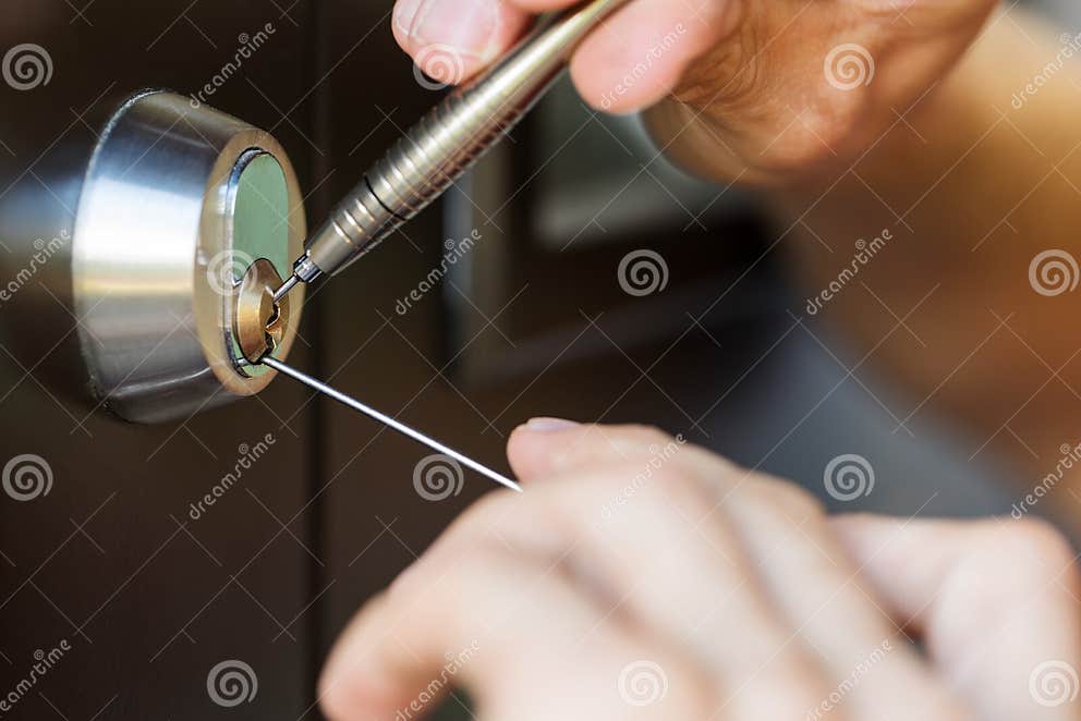 Locksmith Hands Using Pick Tools To Open Locked Door Stock Image ...