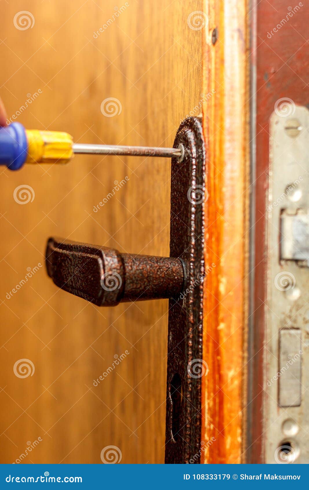 Locksmith Making Installation of Door Lock with Screwdriver. Stock ...
