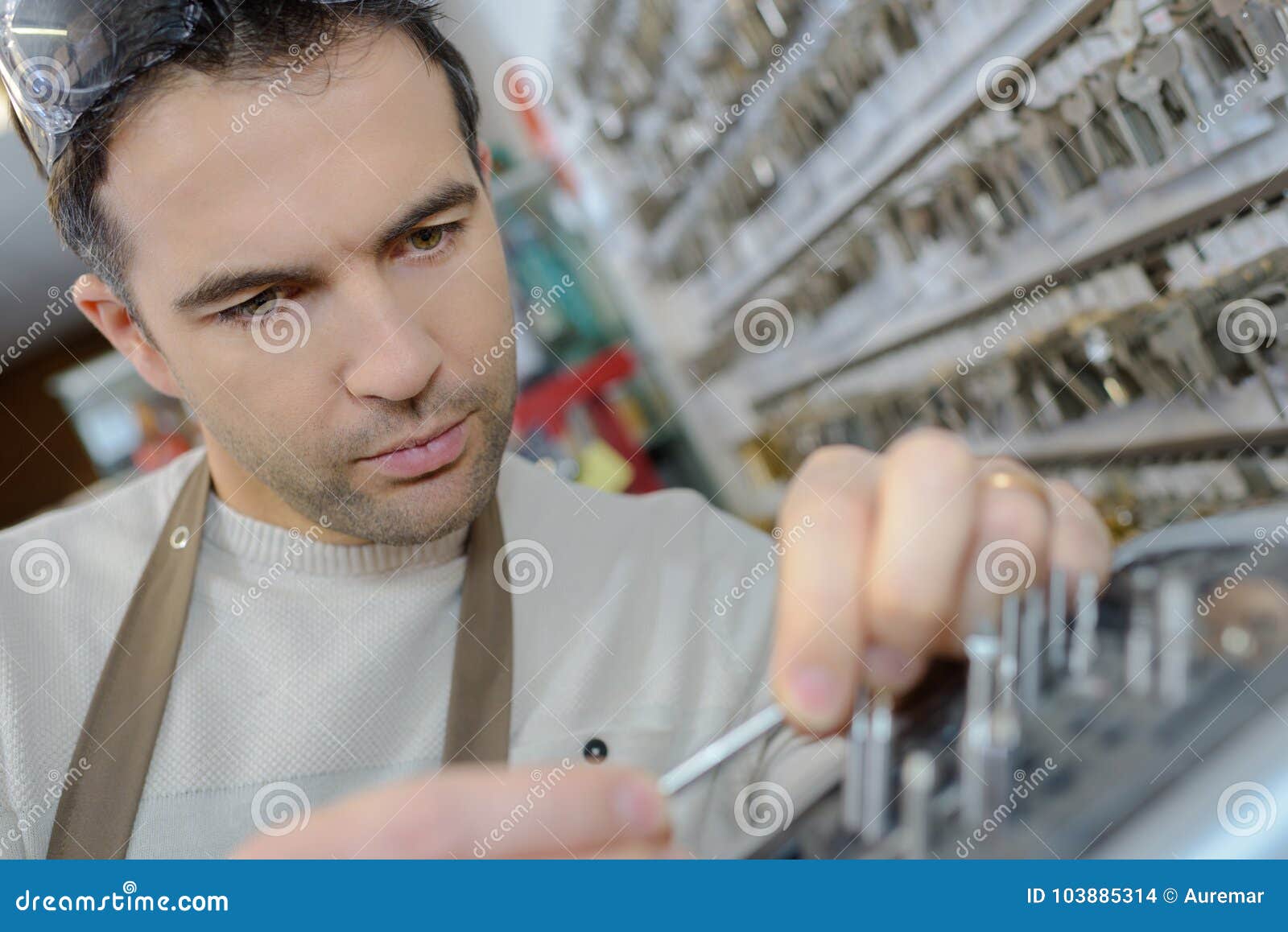 Locksmith making new key stock photo. Image of caucasian - 103885314