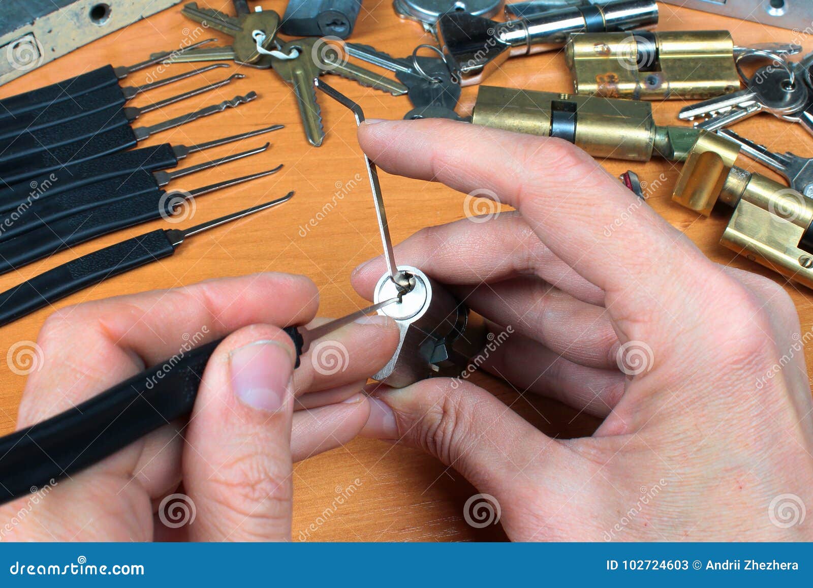 Locksmith Picks a Cylinder Lock with Lockpick and Tension Wrench Stock ...