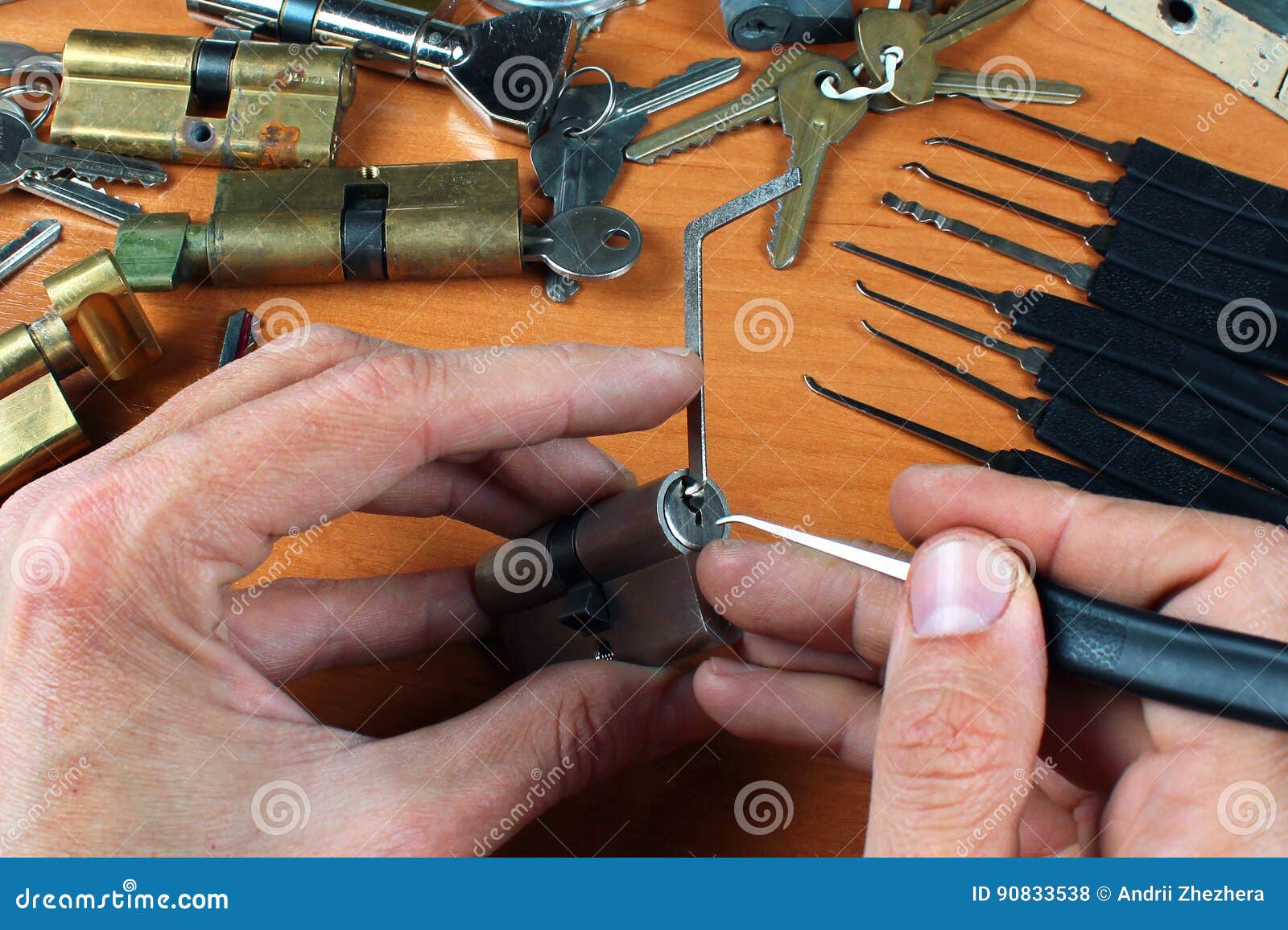Locksmith Picks a Cylinder Lock with Lockpick and Tension Wrench Stock ...