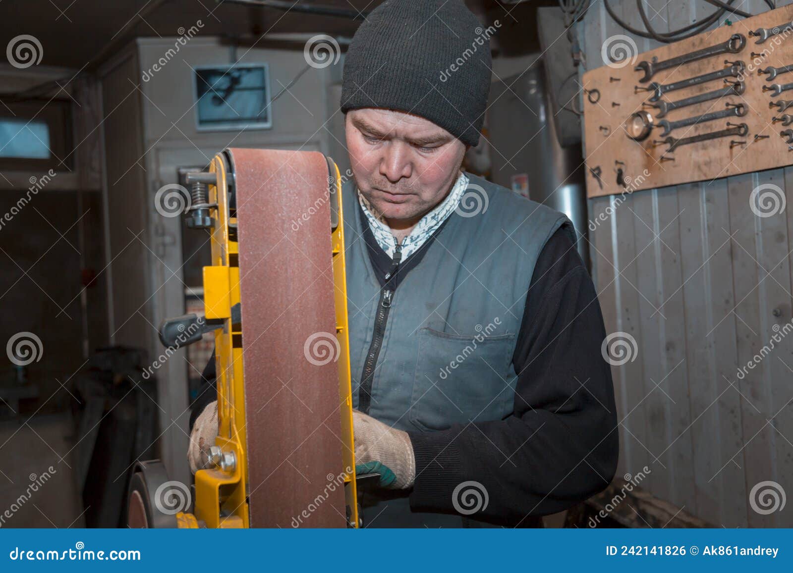 Locksmith Processes a Part on an Emery Machine Stock Photo - Image of ...