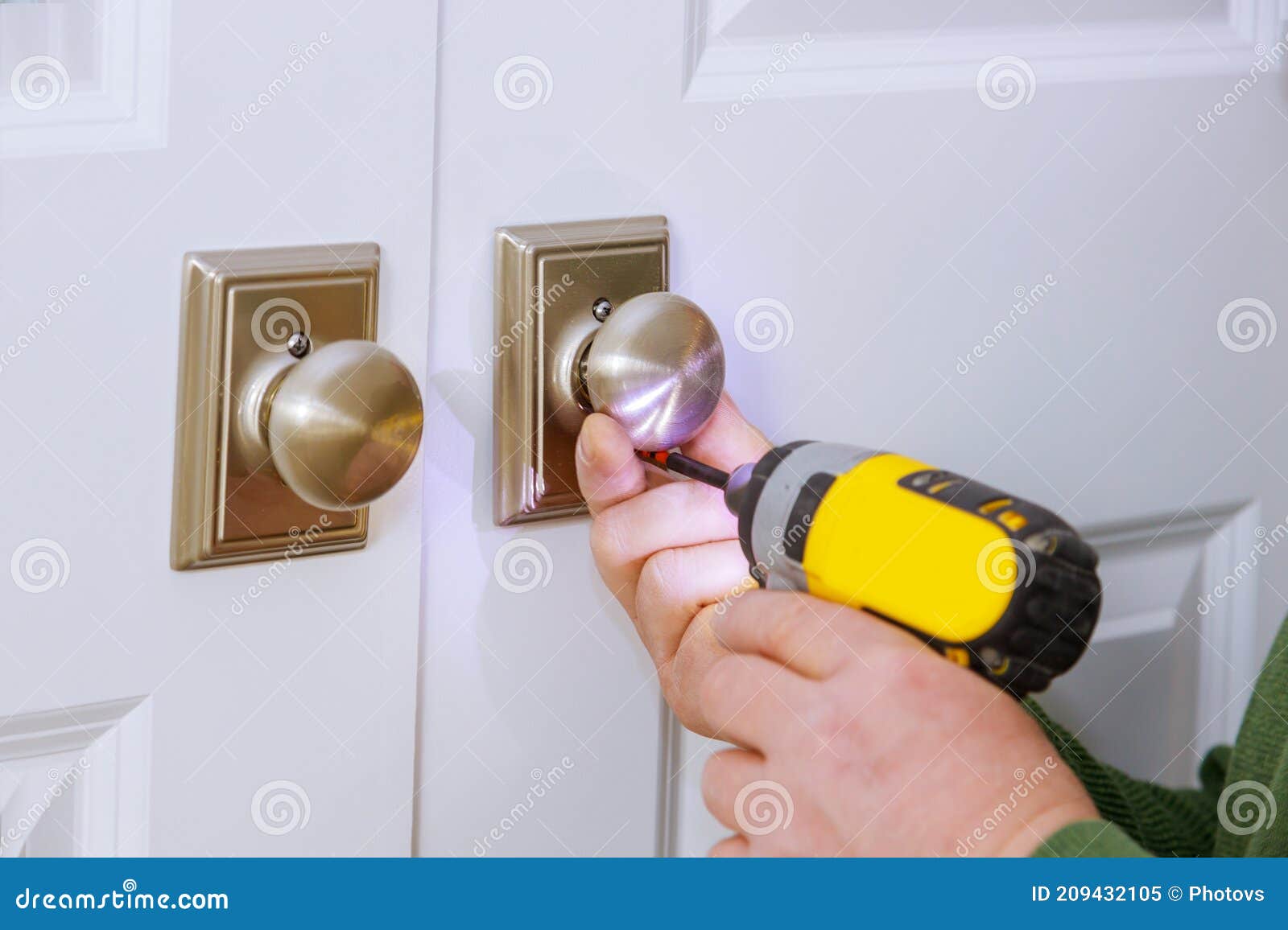 Worker Installing a New Dummy Lock in House on Door Stock Image - Image ...