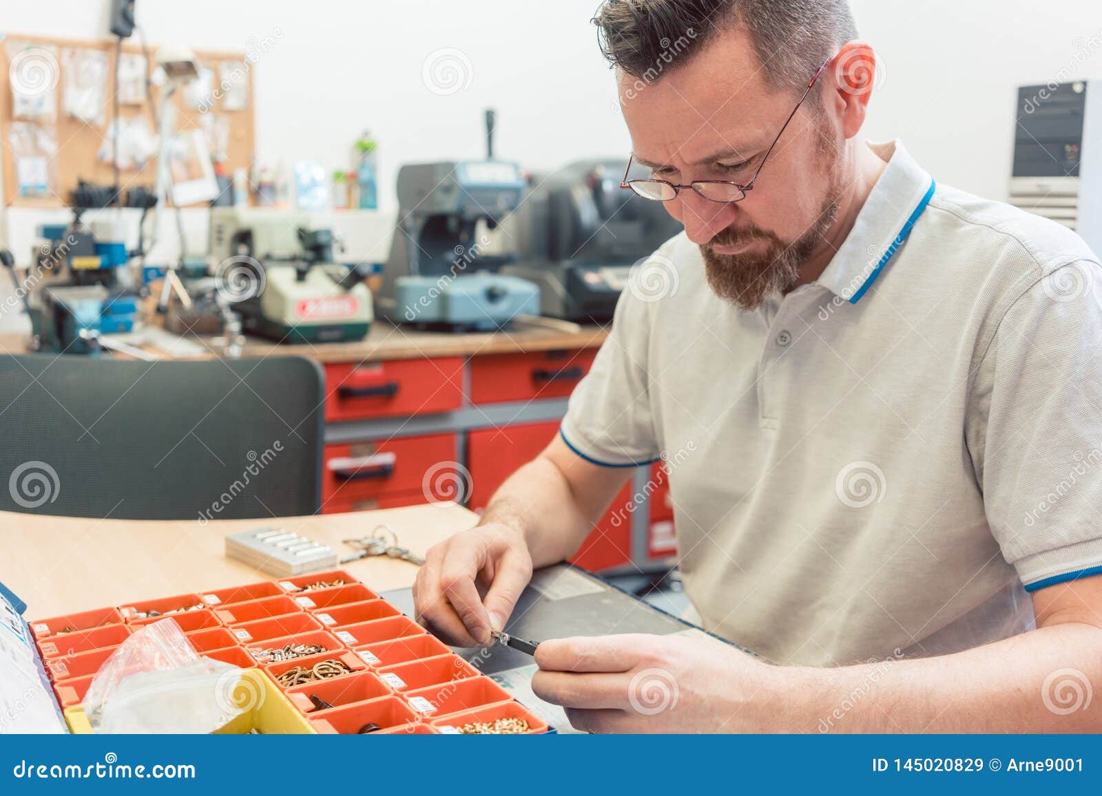 Locksmith Working on a Lock Repairing it Stock Image - Image of service ...