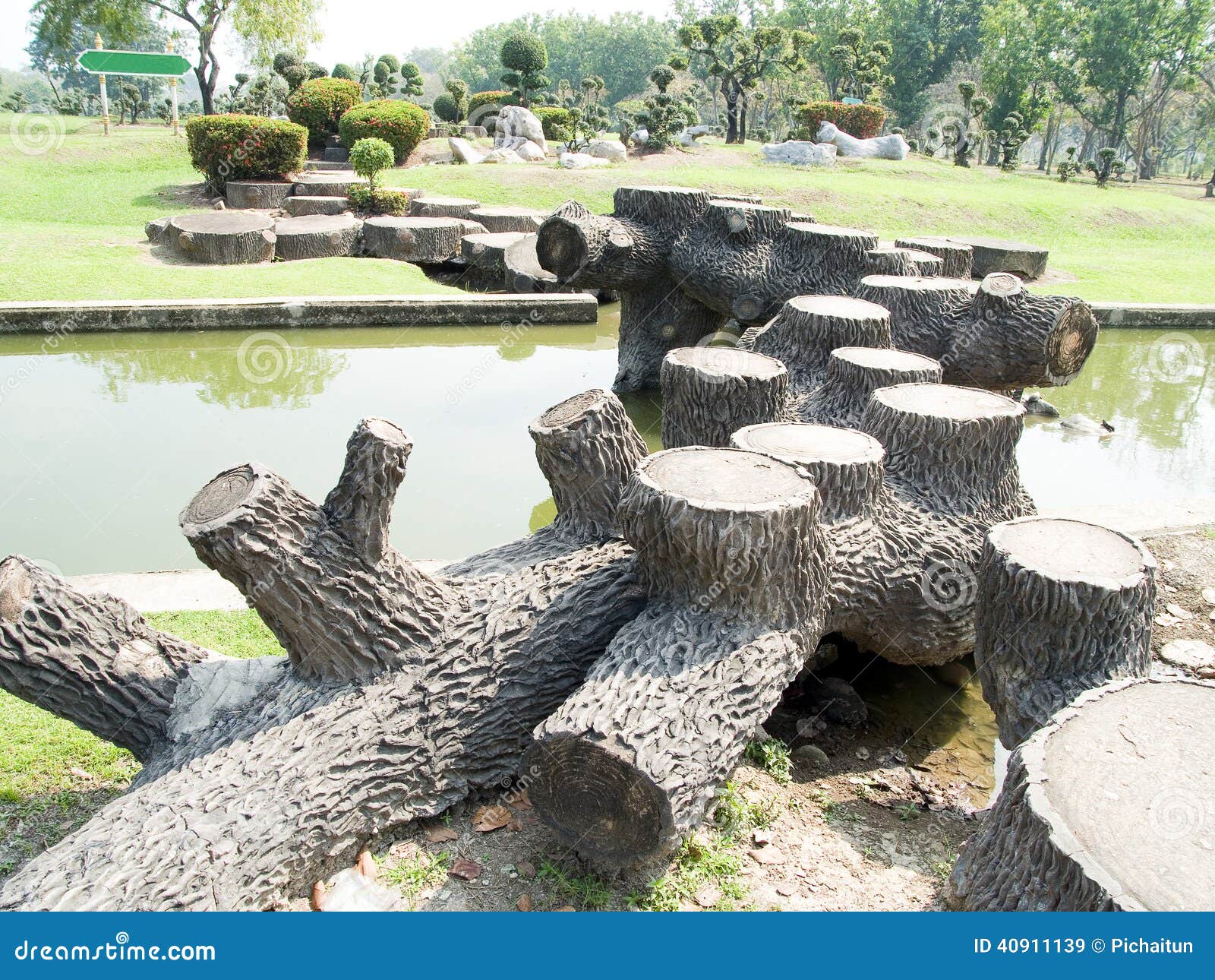 Log bridge and garden plot stock image. Image of leisure - 40911139